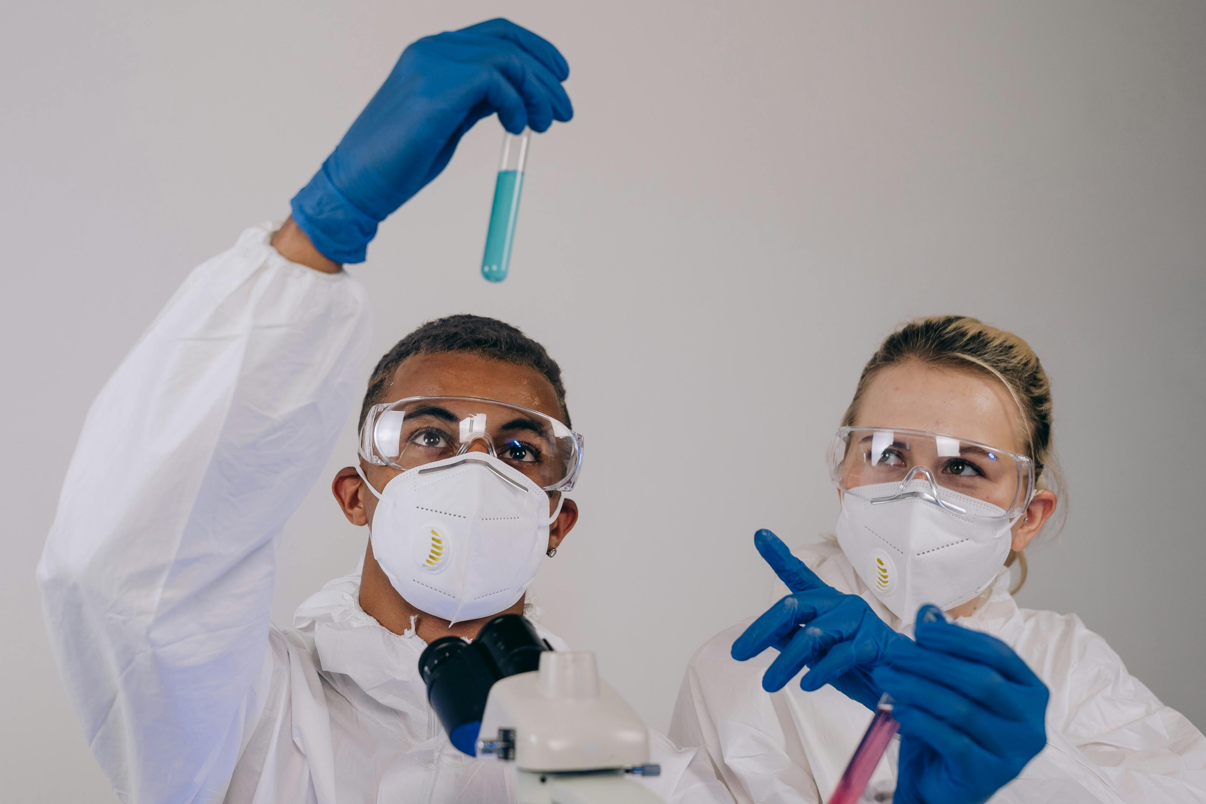 Two Scientists with a Vial · Free Stock Photo