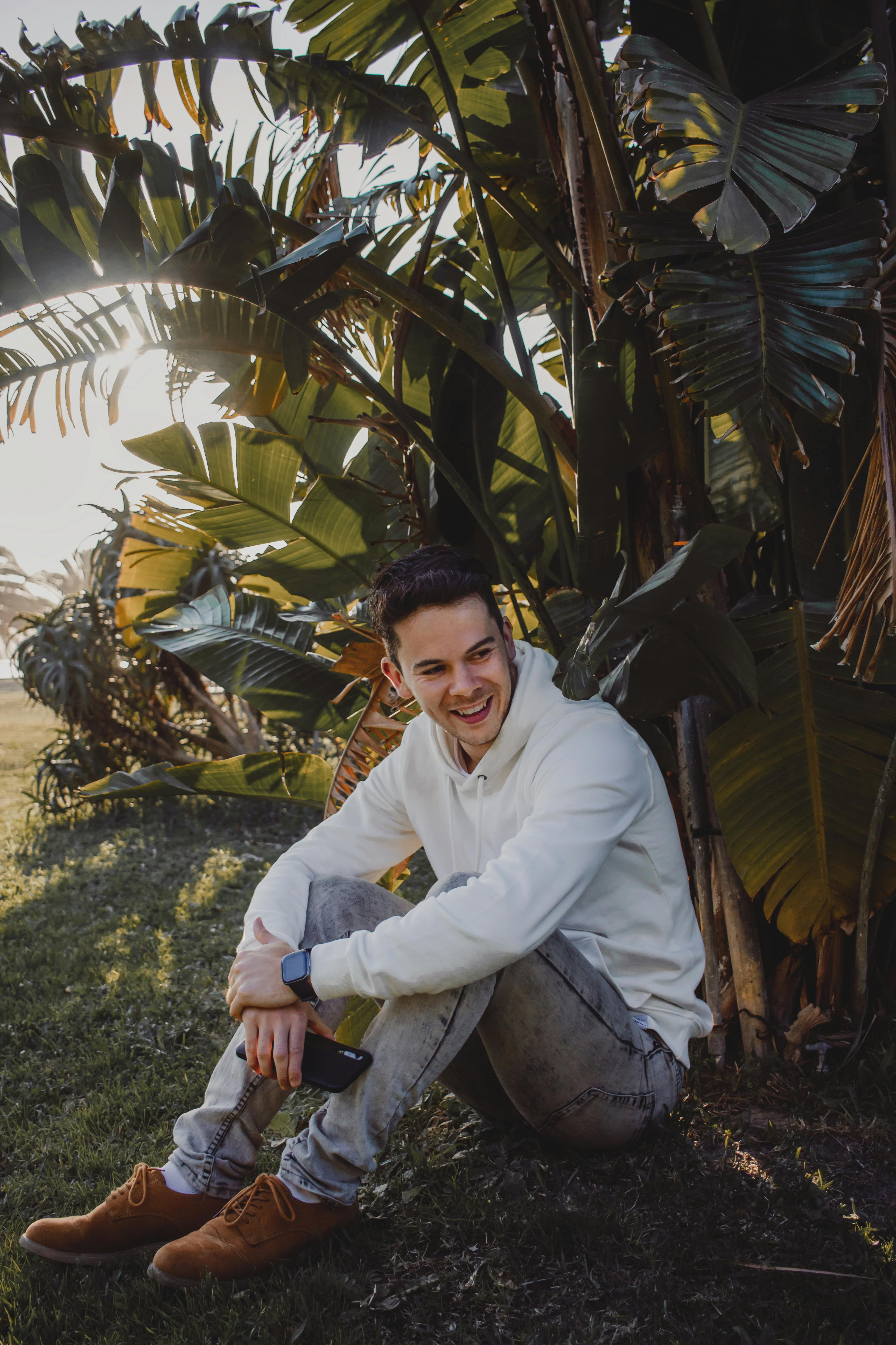 Man Sitting and Posing on Road · Free Stock Photo