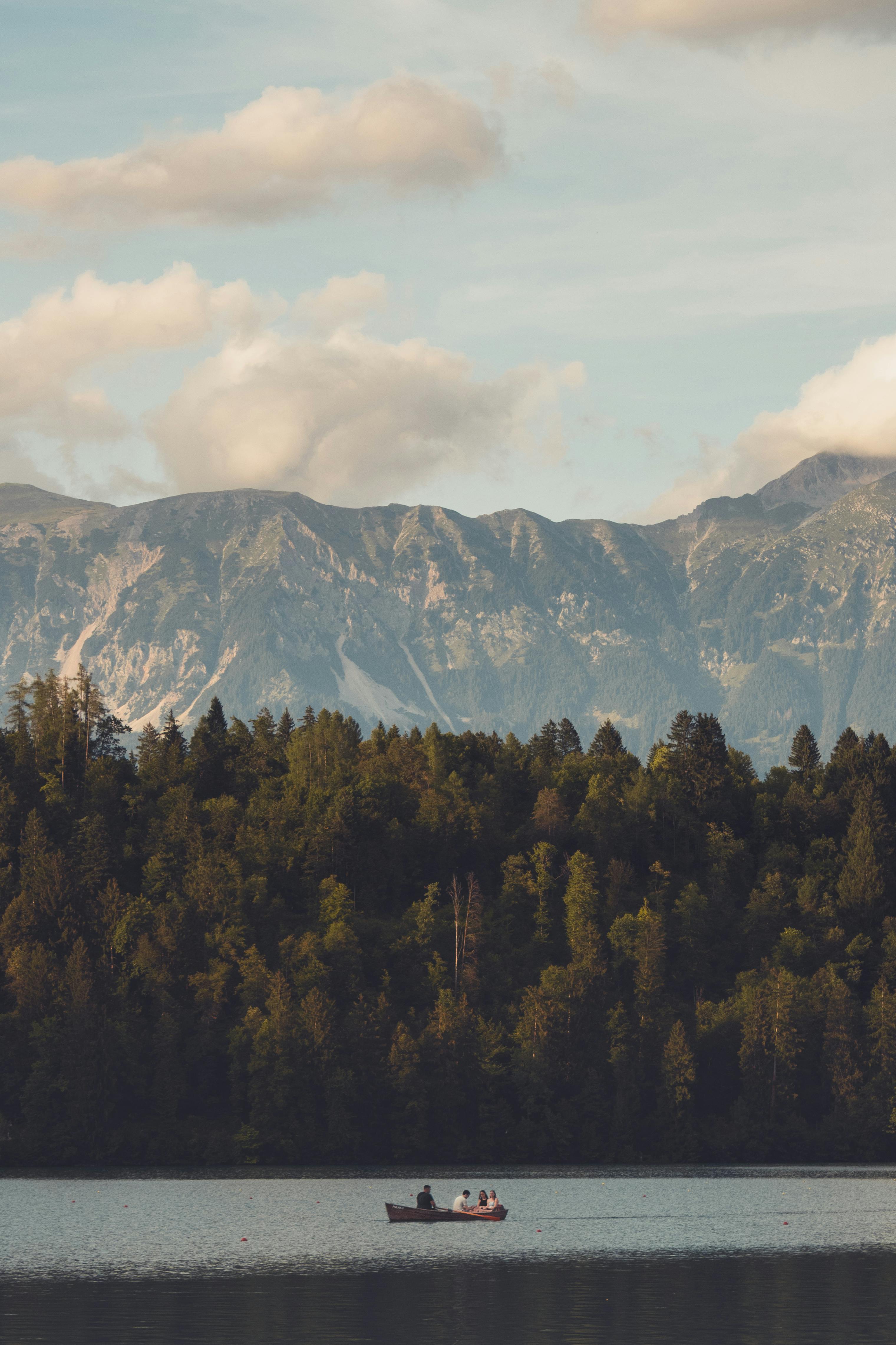 Person Standing on a Brown Wood Log Floating on a Body of Water · Free ...