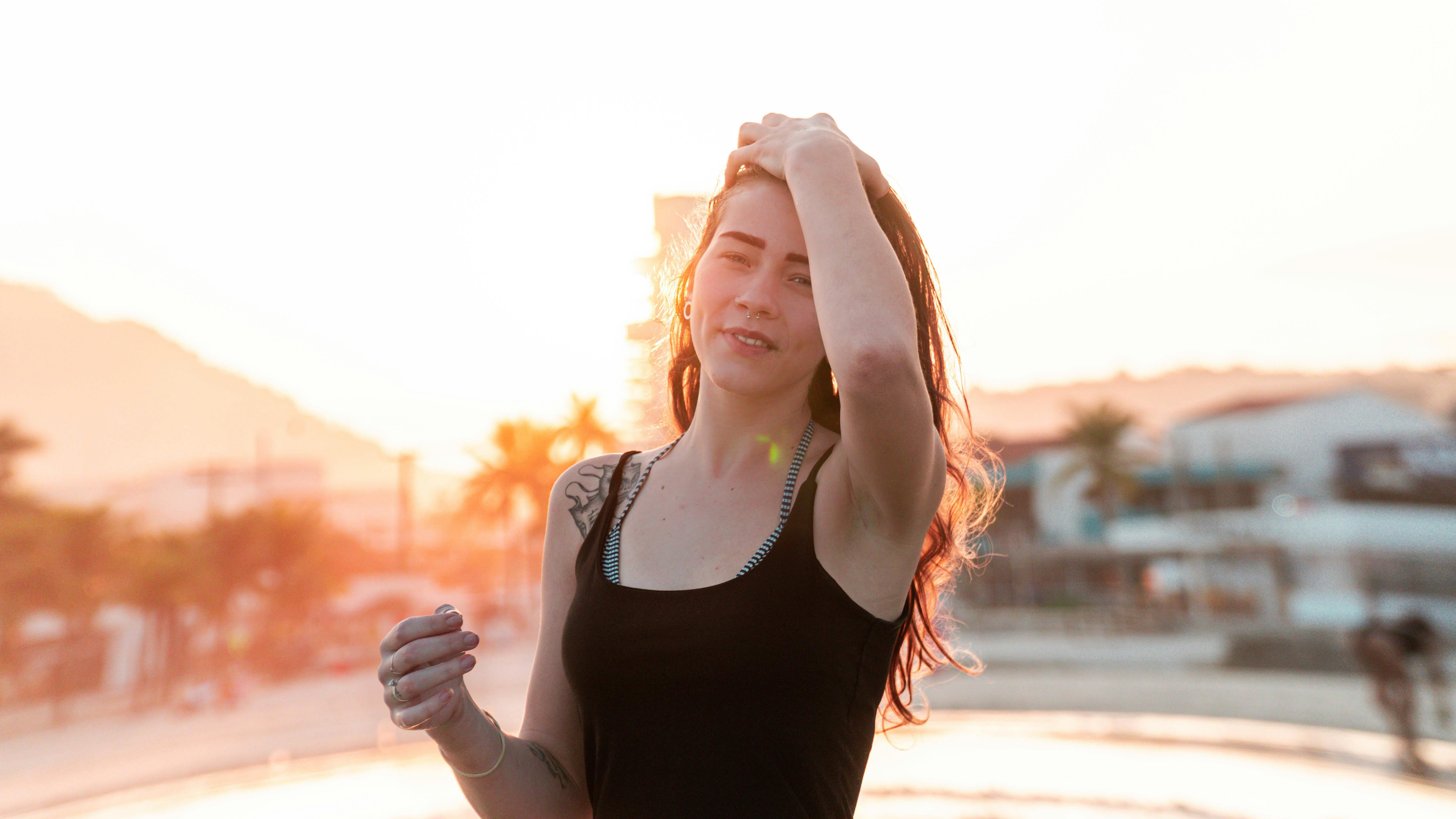 A Woman Trimming her Hair using Hair Clipper · Free Stock Photo
