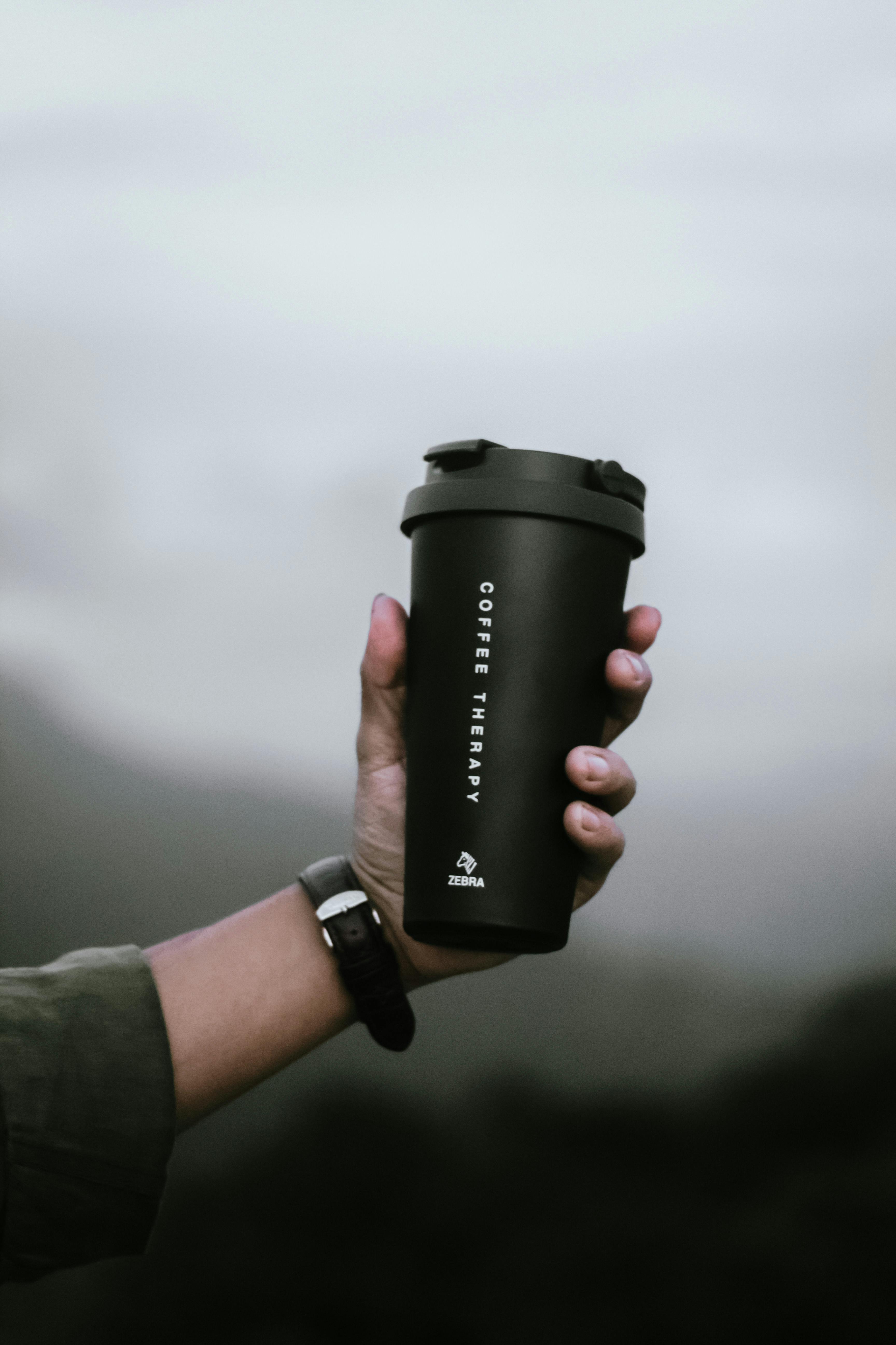 Close Up Shot of a Person Holding a Tumbler · Free Stock Photo