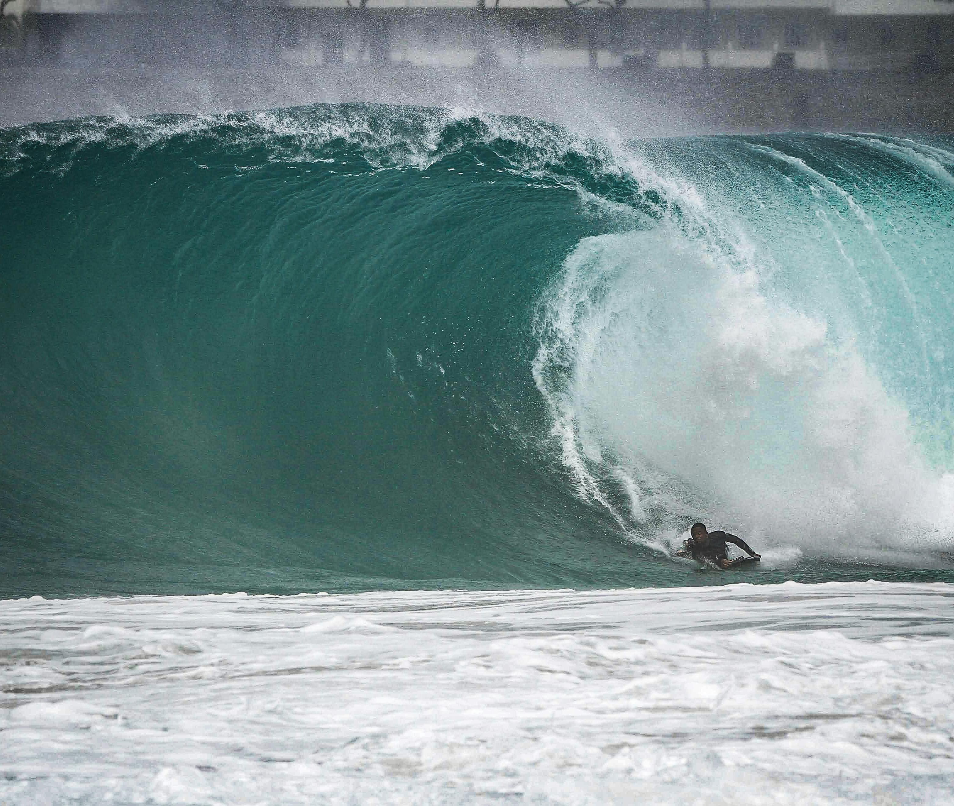 A Surfer Under a Big Wave · Free Stock Photo