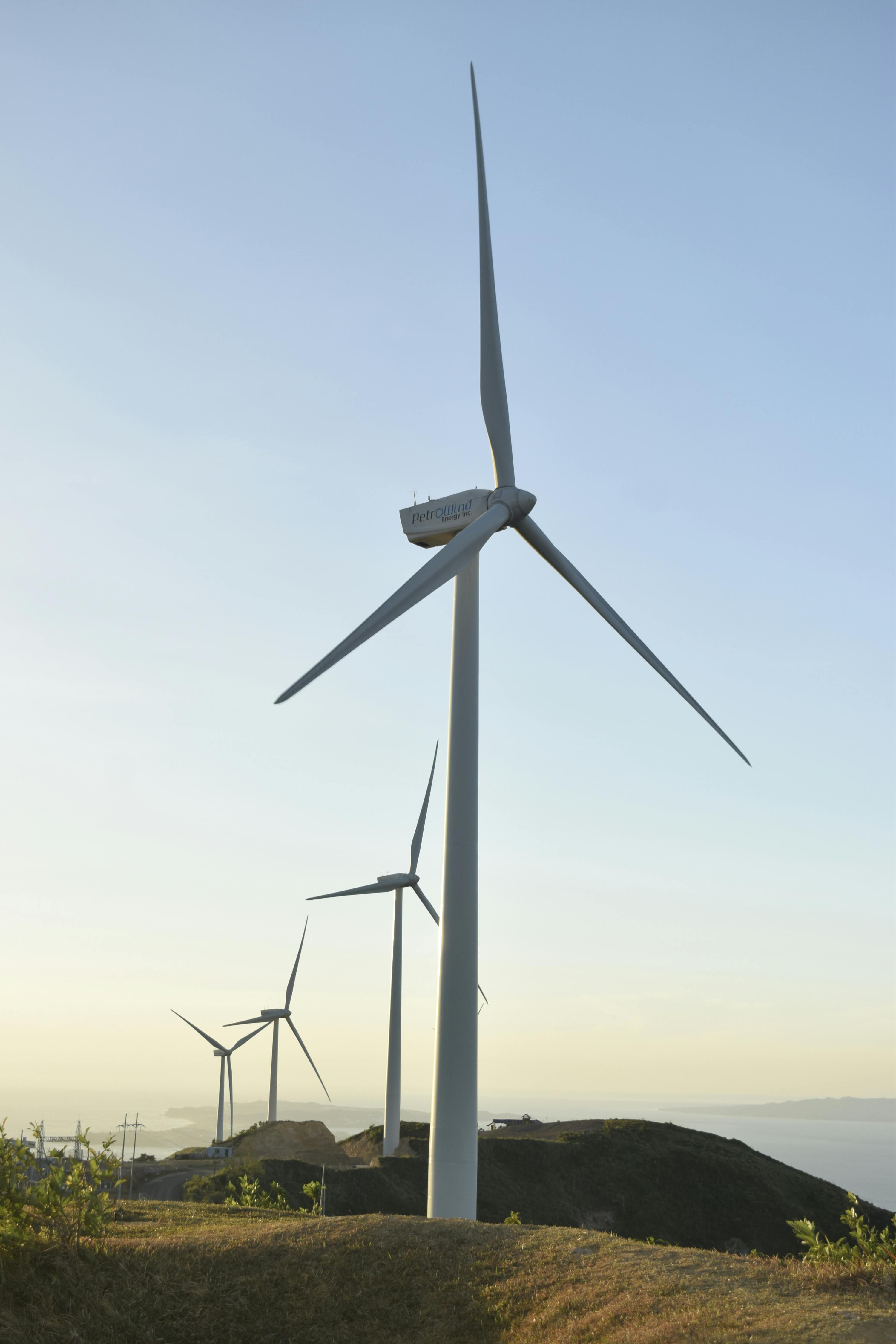 Photo of White Wind Turbines Under a Clear Sky · Free Stock Photo