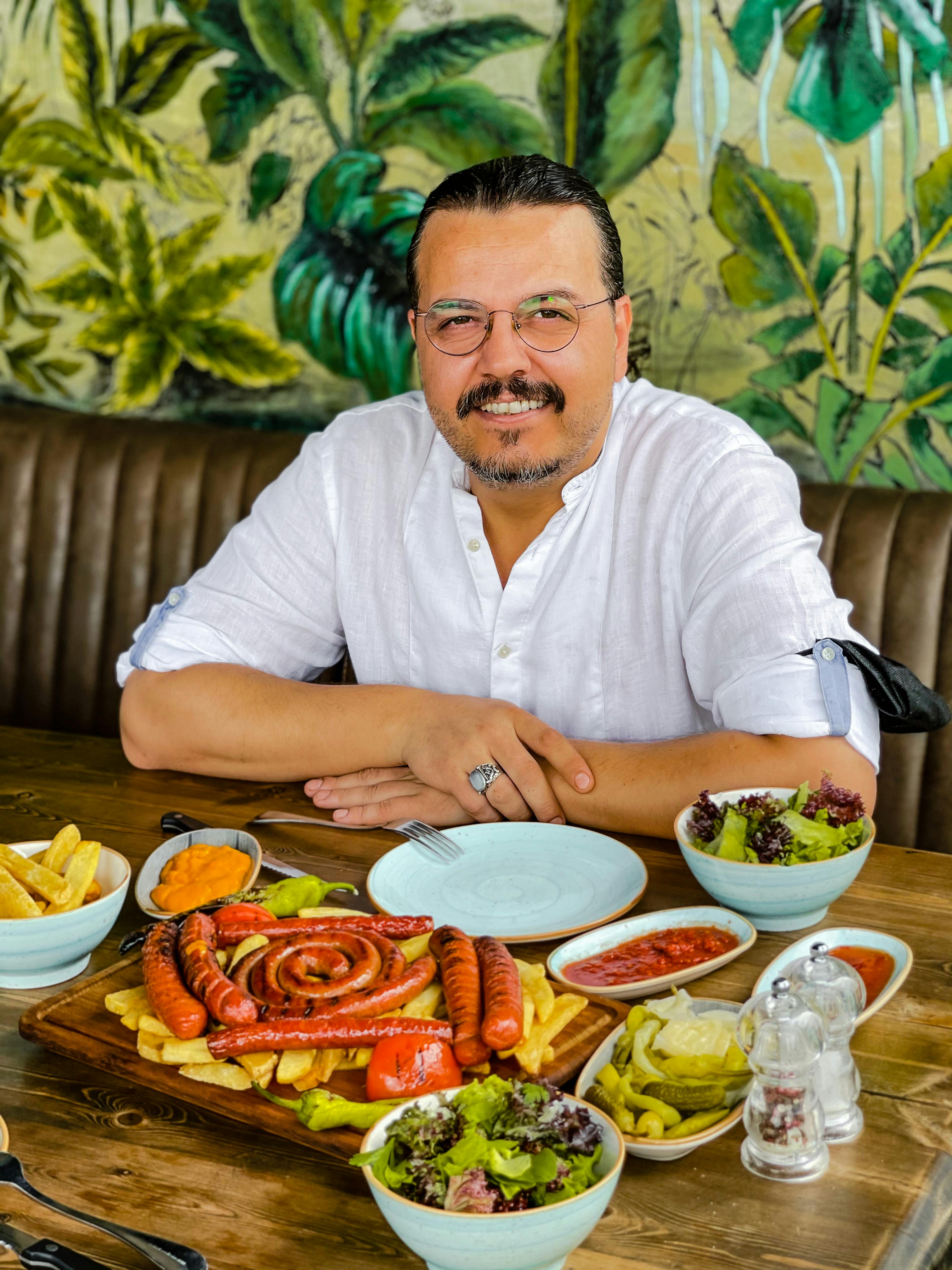 Old Yogi Man Crouching in Gate of Ancient Building · Free Stock Photo