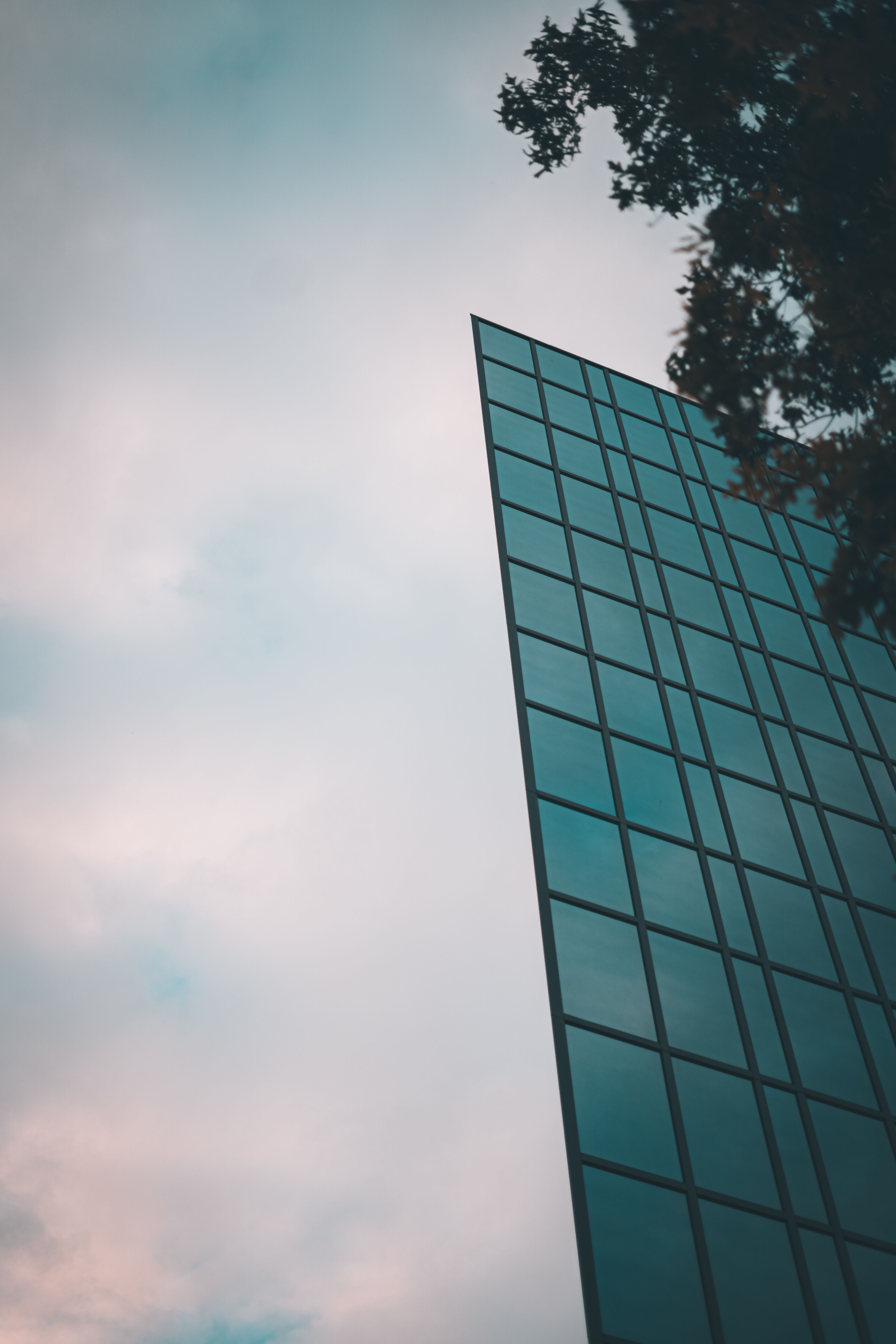 Glass Building Under Cloudy Sky · Free Stock Photo