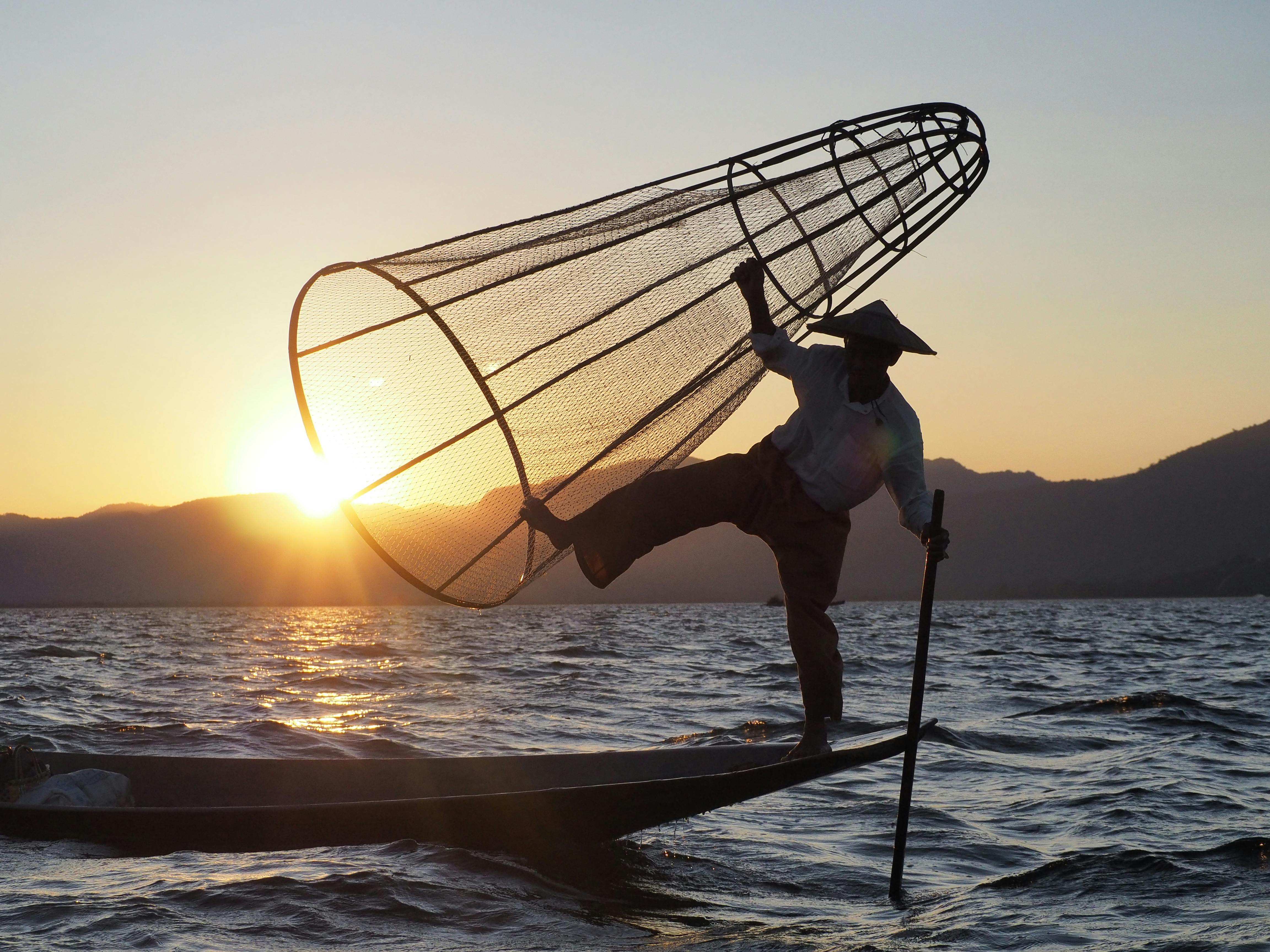 Fisherman throwing Fish Net on Lake · Free Stock Photo