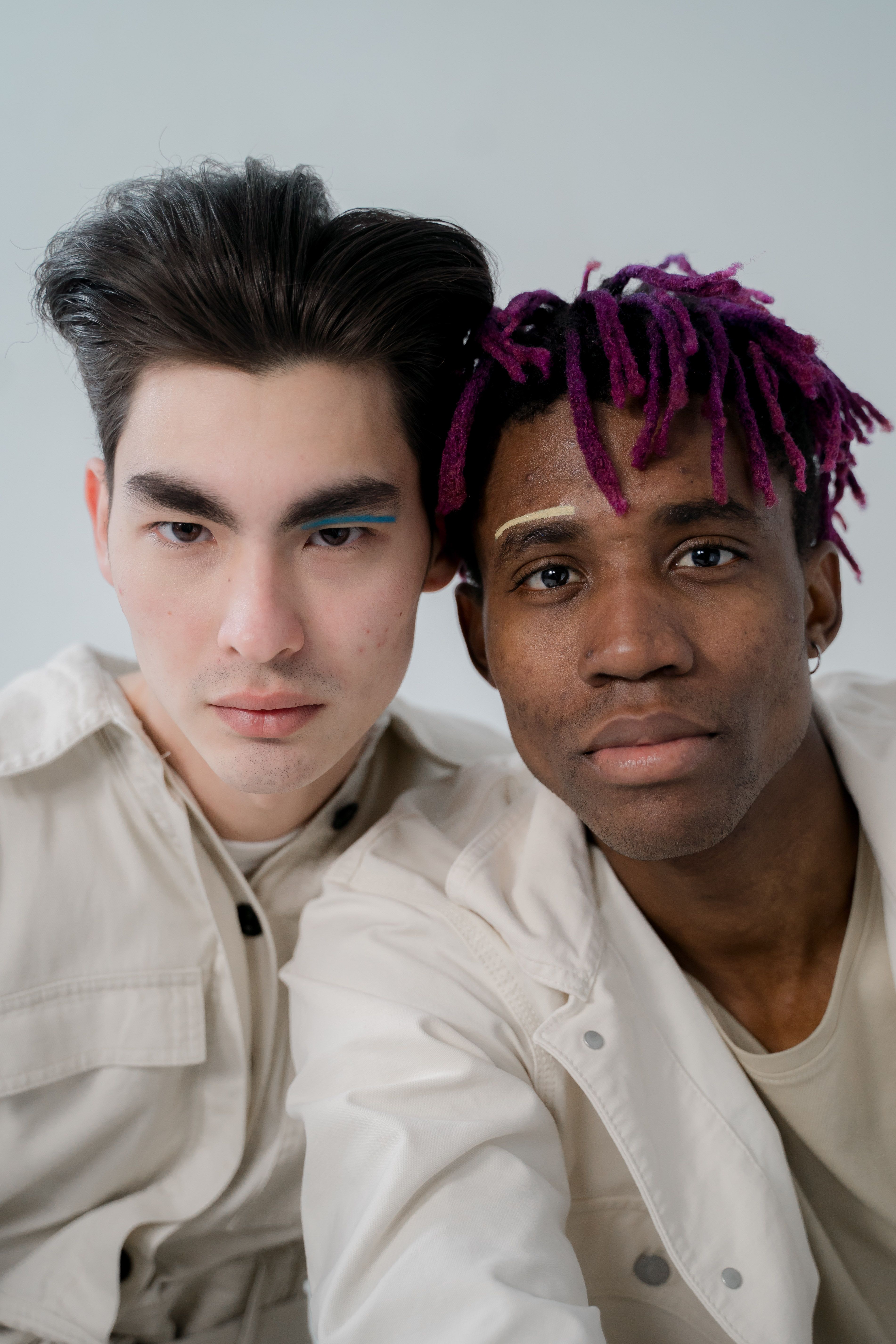Close-Up Shot of Two Men Looking at Camera · Free Stock Photo