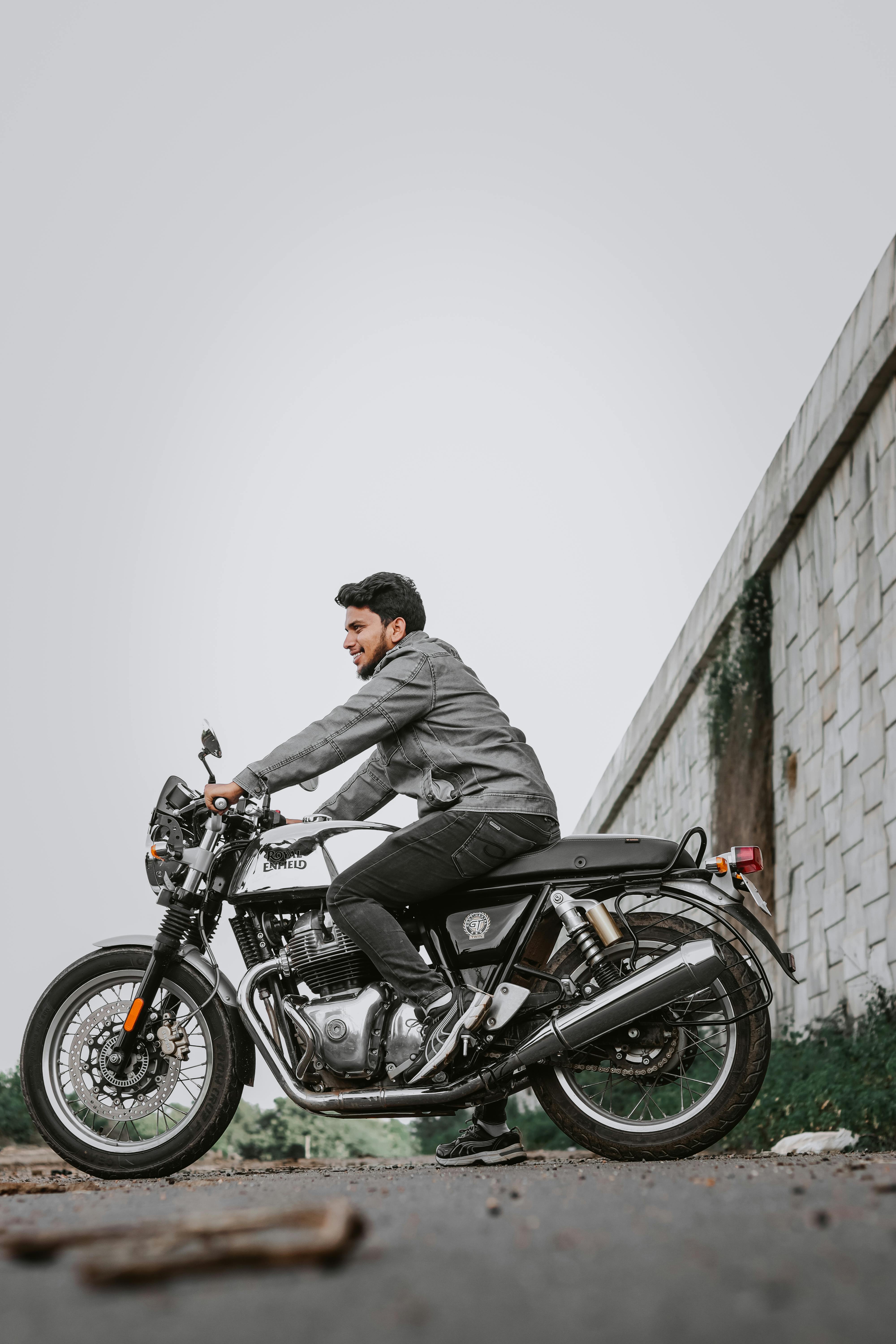 Man Sitting on Motorcycle in City · Free Stock Photo
