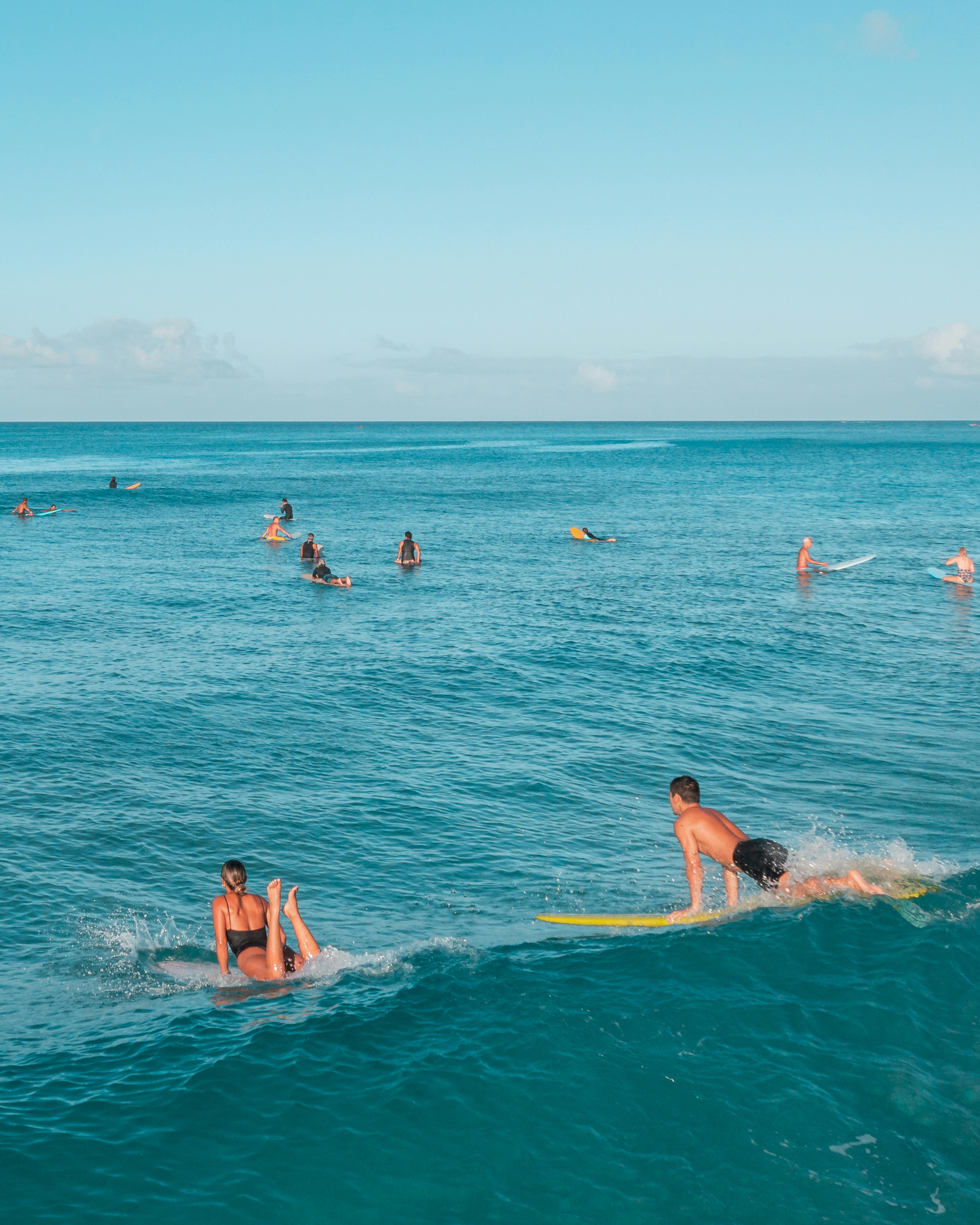 People Surfing on the Beach · Free Stock Photo