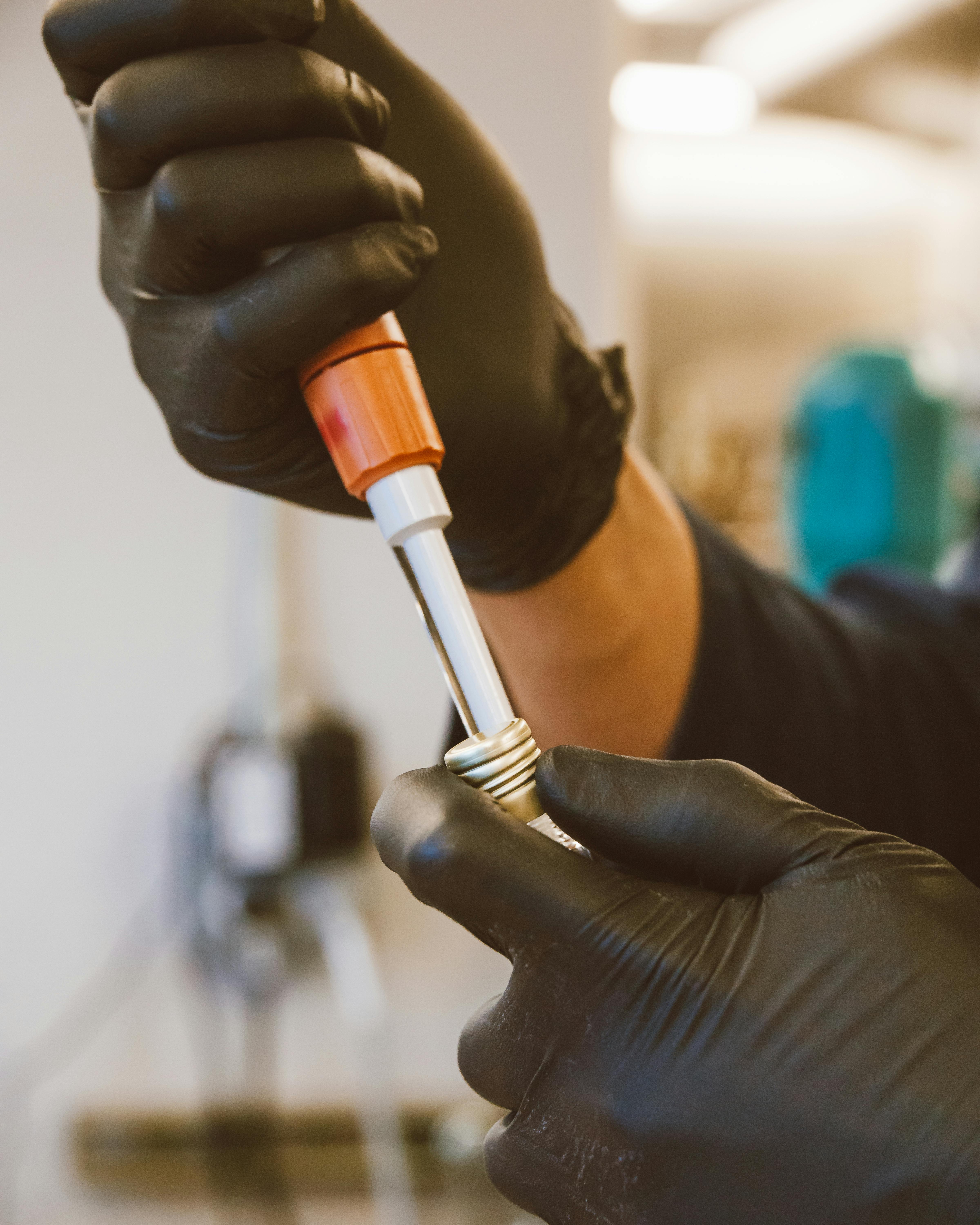 Close up of a Person Using Lab Equipment · Free Stock Photo