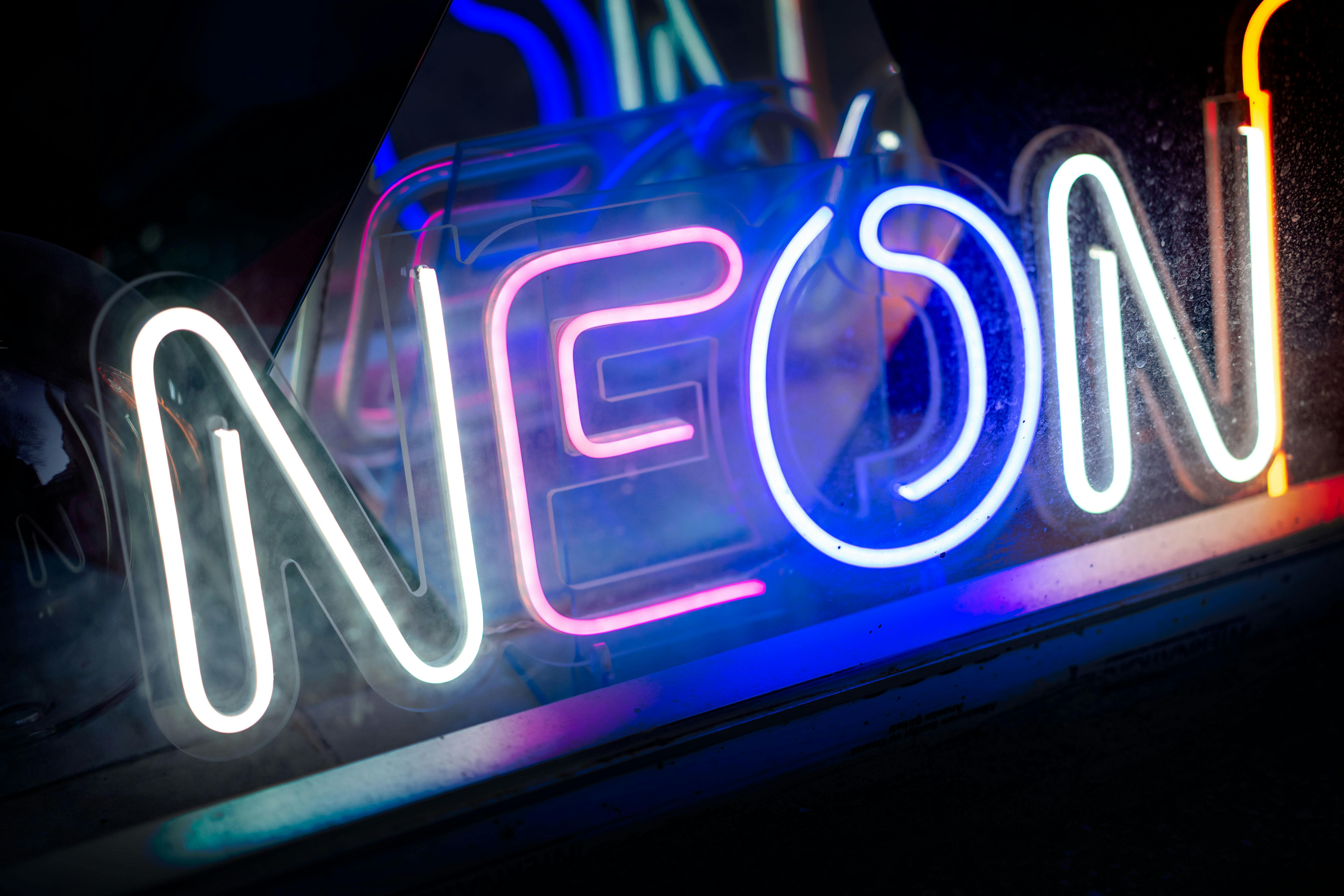 A Blue Illuminated Neon Sign · Free Stock Photo