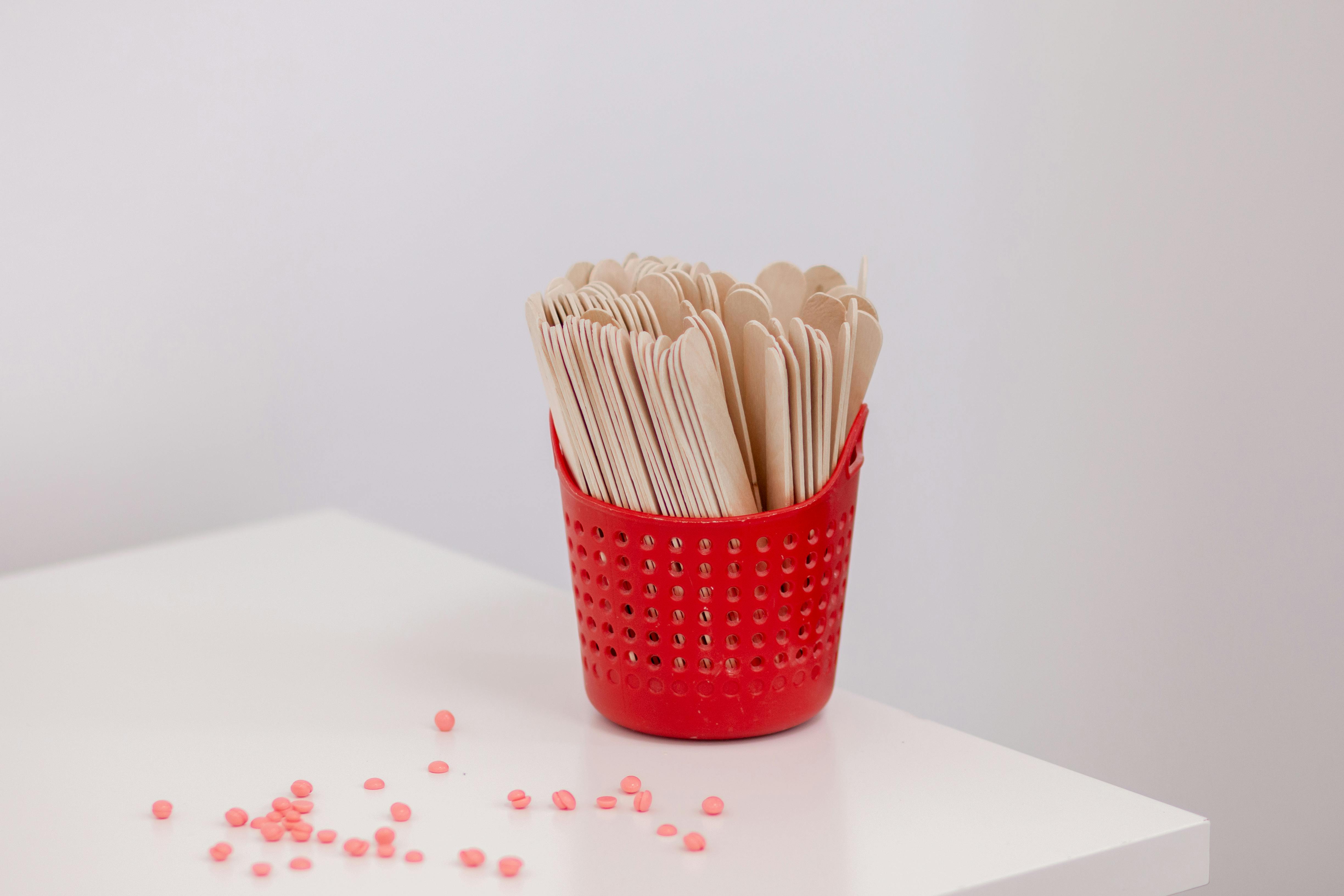 Small Red Basket with Wooden Medical Spatulas · Free Stock Photo