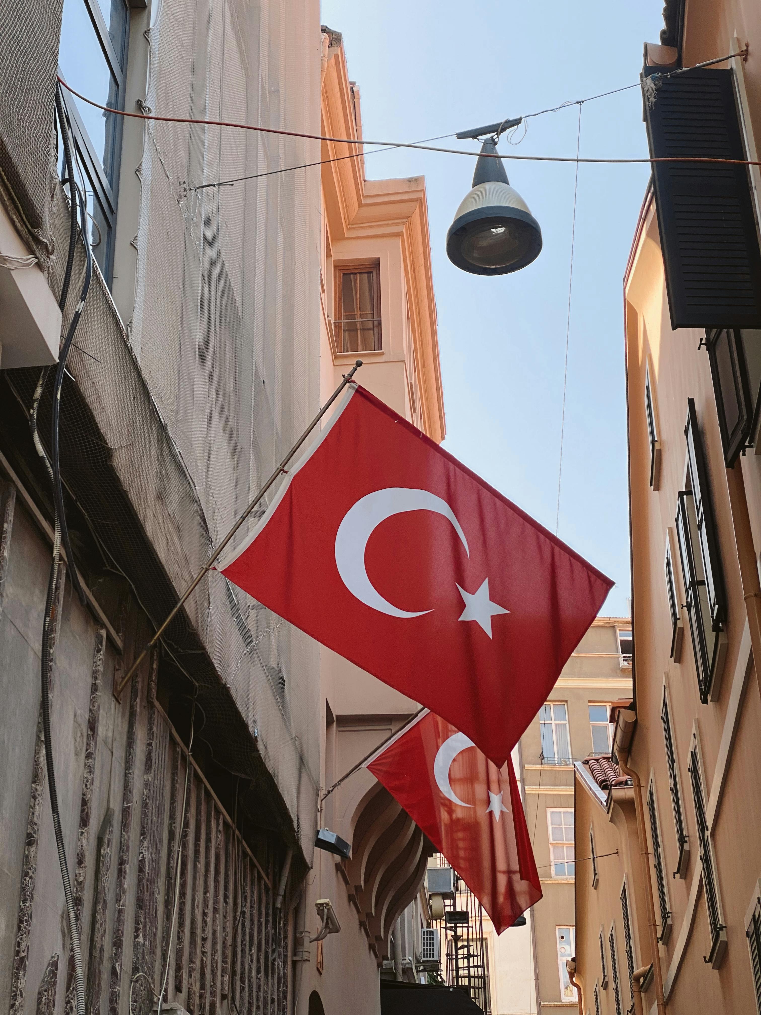 Turkish Flags Beside an Apartment Building · Free Stock Photo
