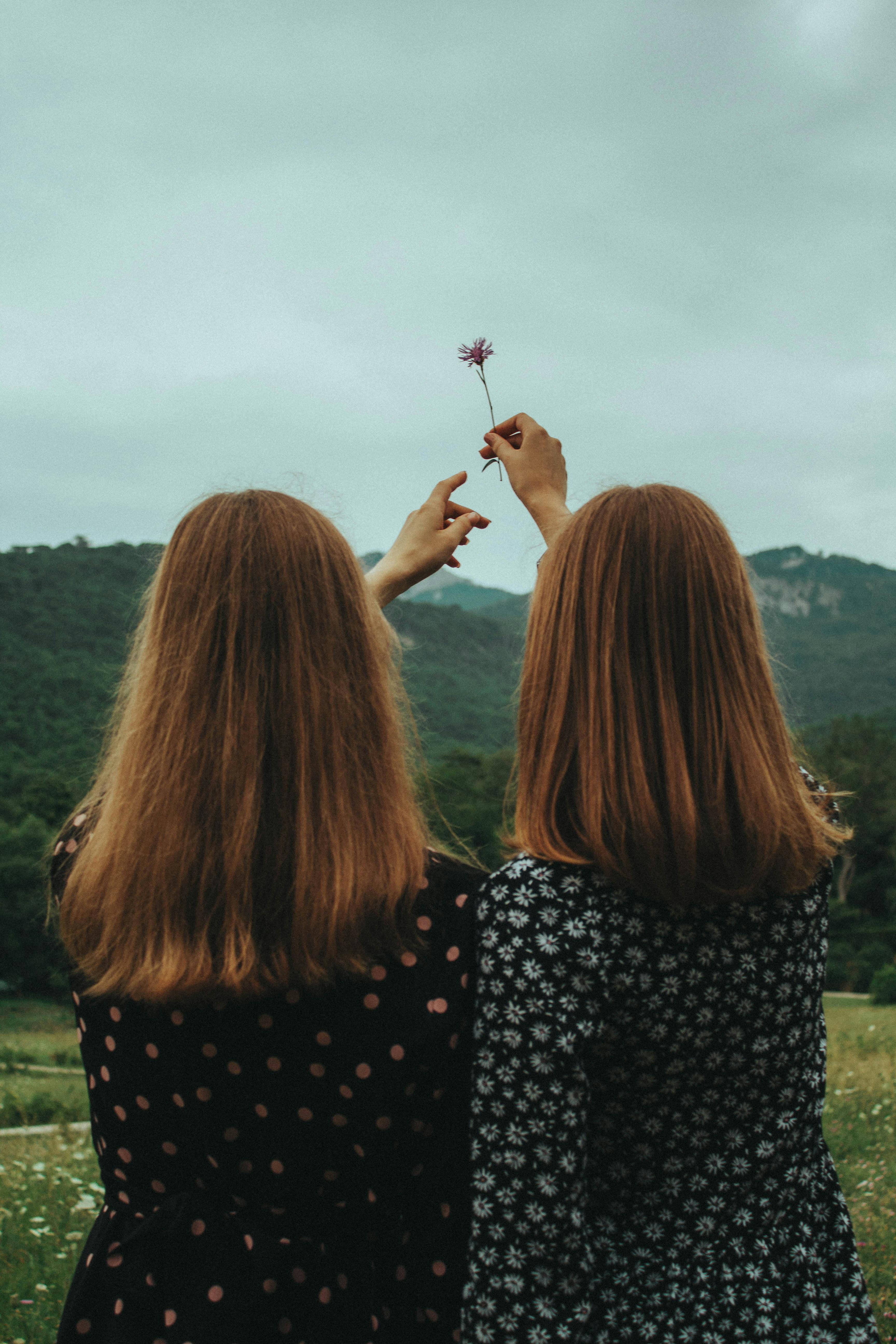 Back View of Girls Wearing Floral Dresses · Free Stock Photo