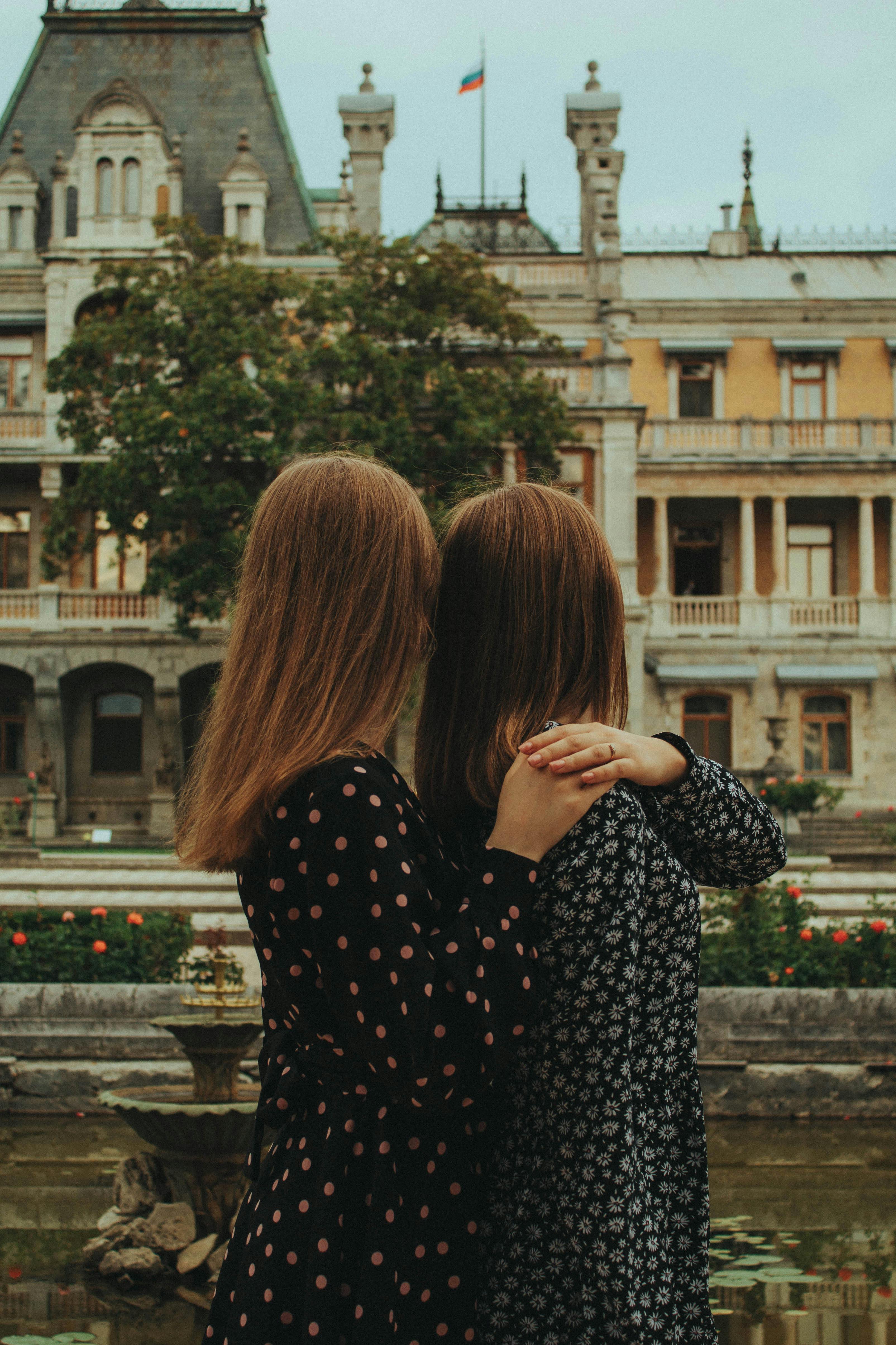 A Girl and a Boy Putting Arms Around Each Other's Shoulder · Free Stock ...