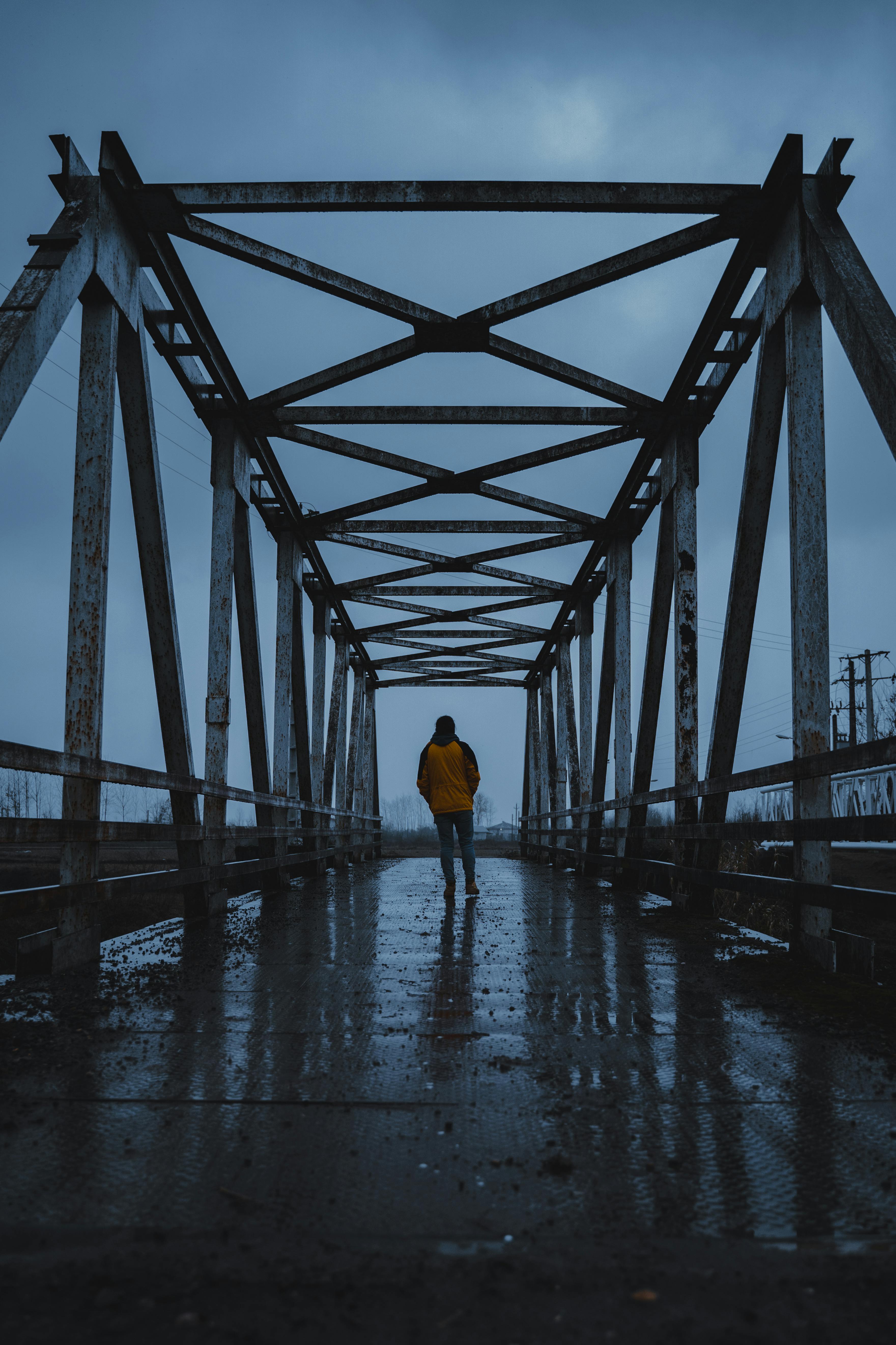 Man Standing on a Bridge · Free Stock Photo