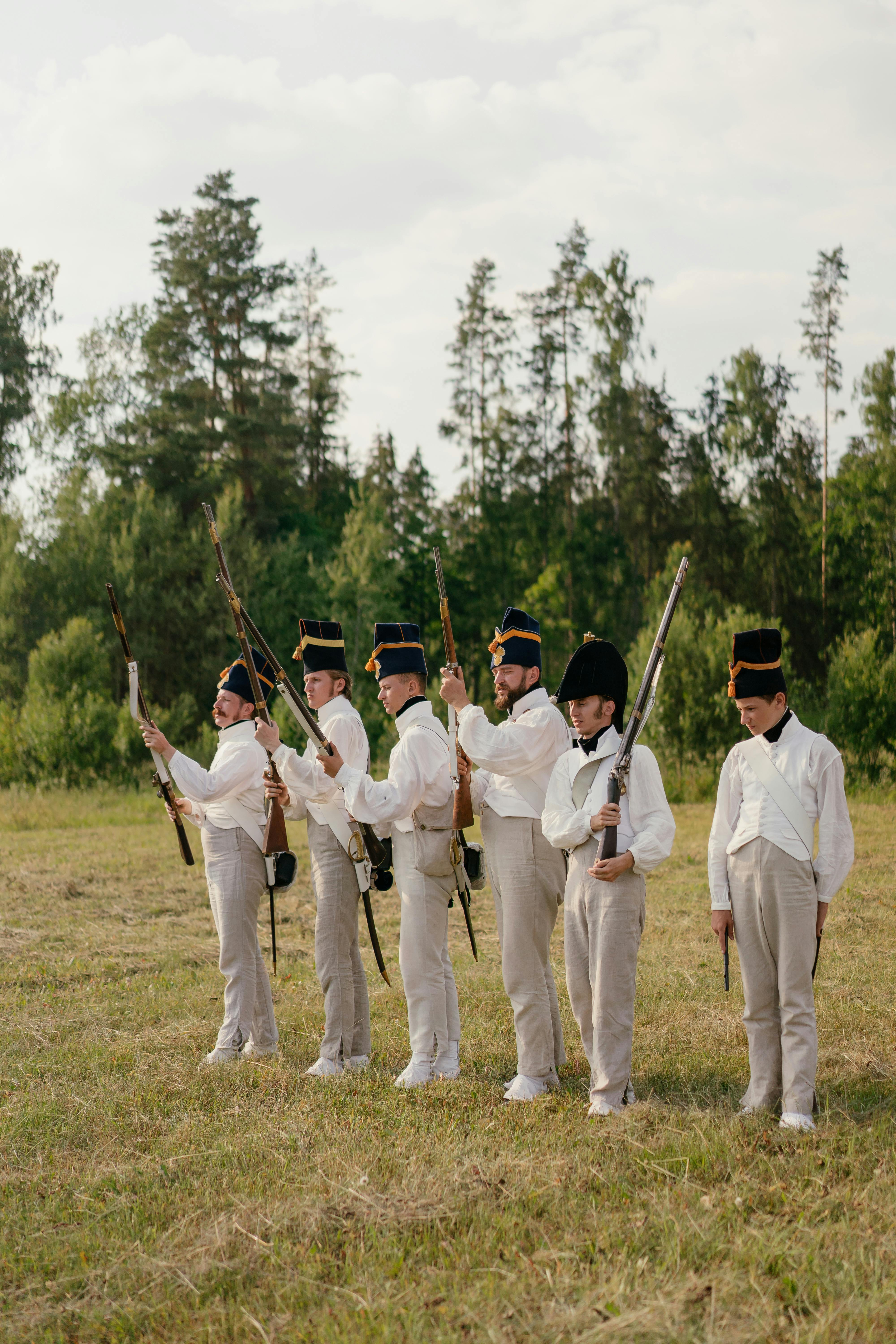 Group of Men in Army Uniforms at Historical Reenactment · Free Stock Photo