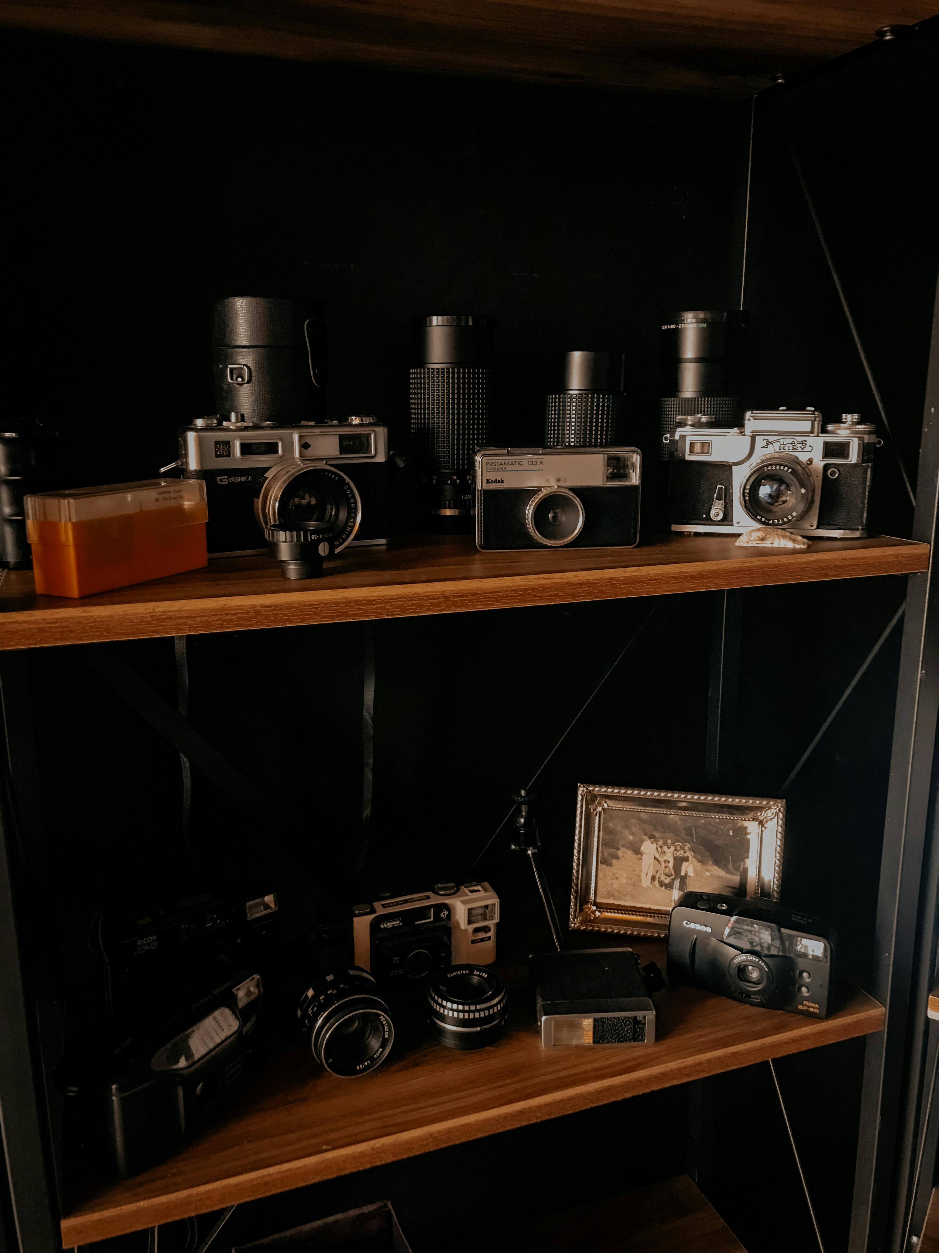 Vintage Cameras on Brown Wooden Shelf · Free Stock Photo