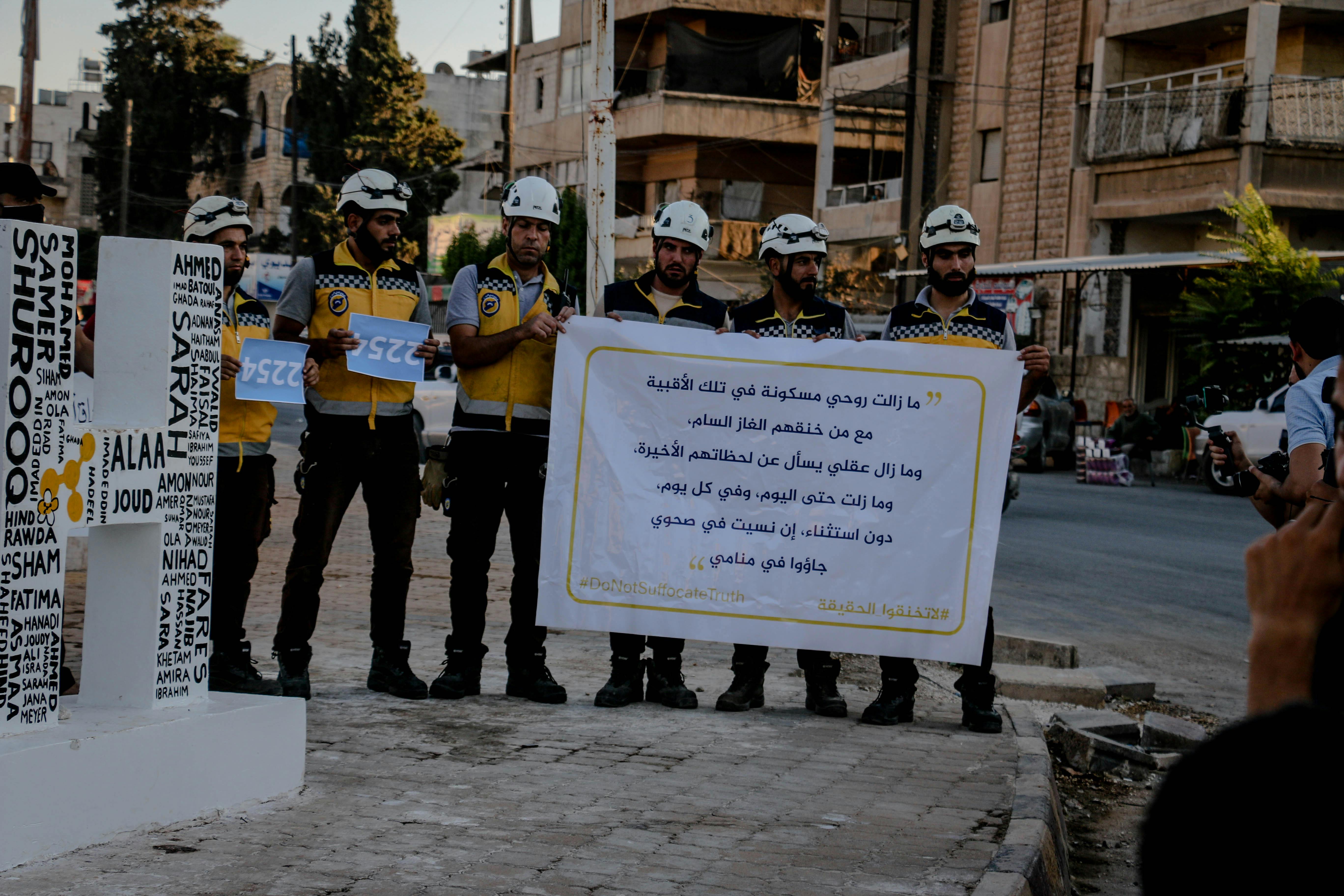 Group of Men Wearing Safety Helmets Protesting on the Street · Free ...