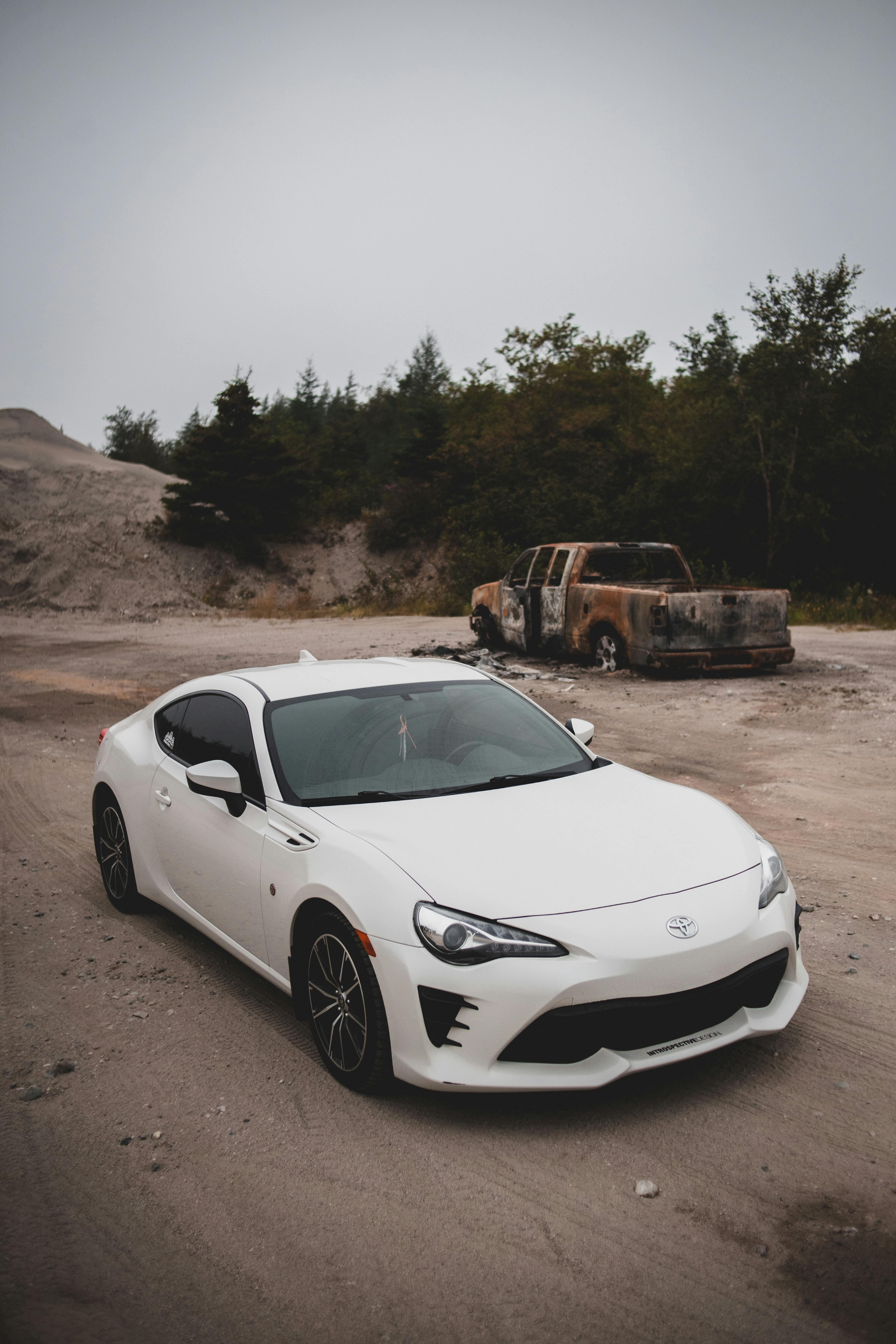 Rear View on White Toyota in Autumn · Free Stock Photo