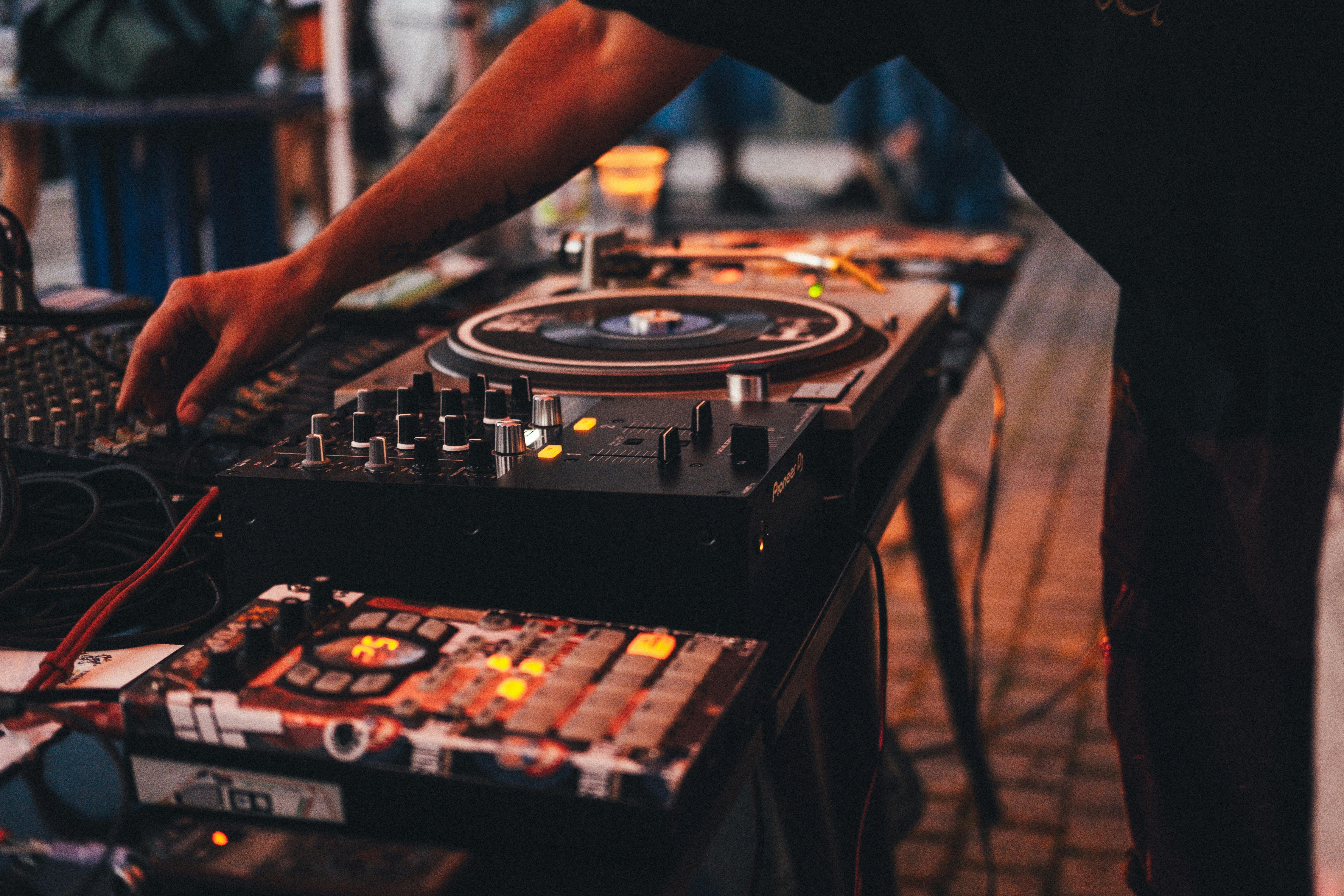 Person Using DJ Mixer · Free Stock Photo