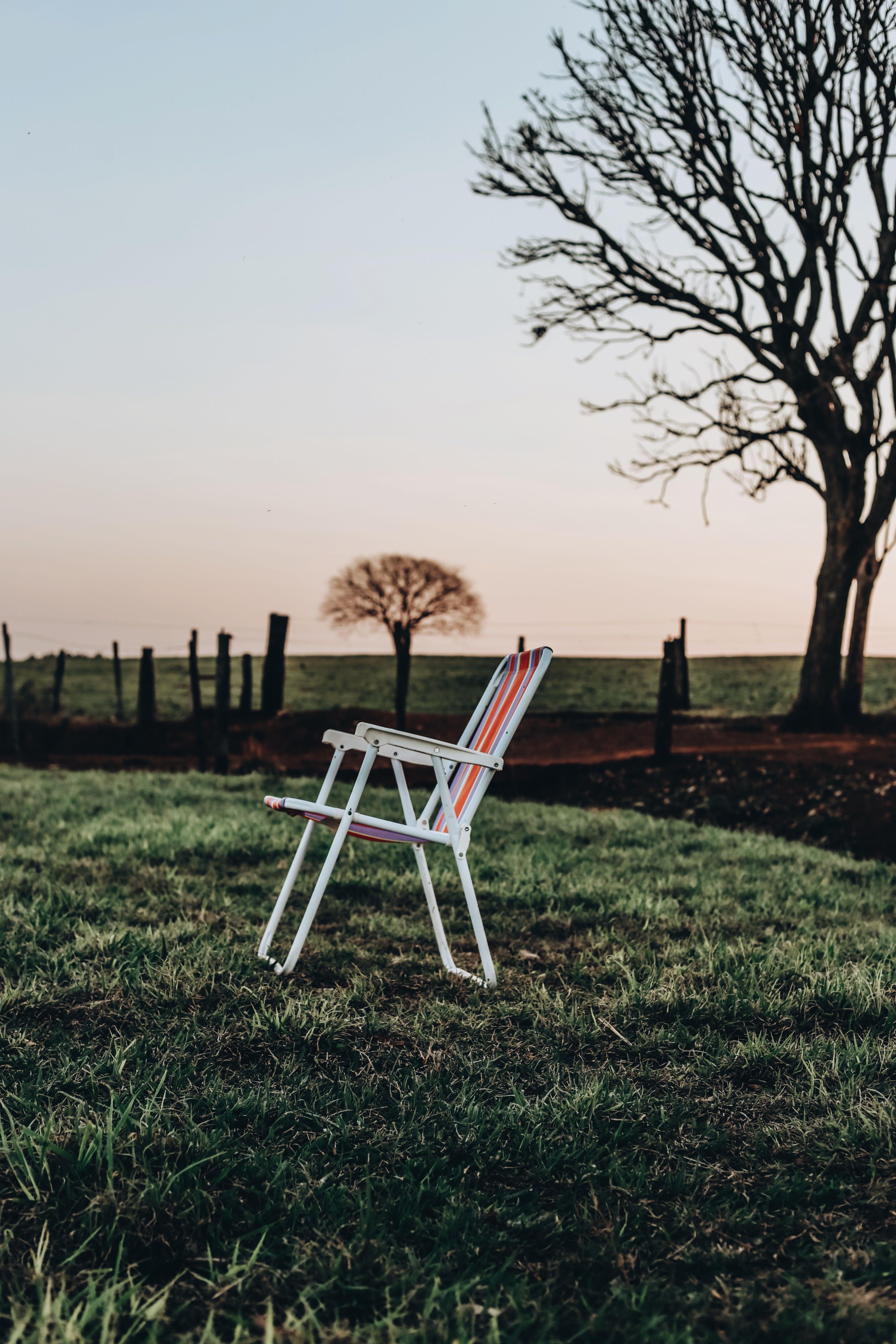 Folding Chair on Green Grass · Free Stock Photo