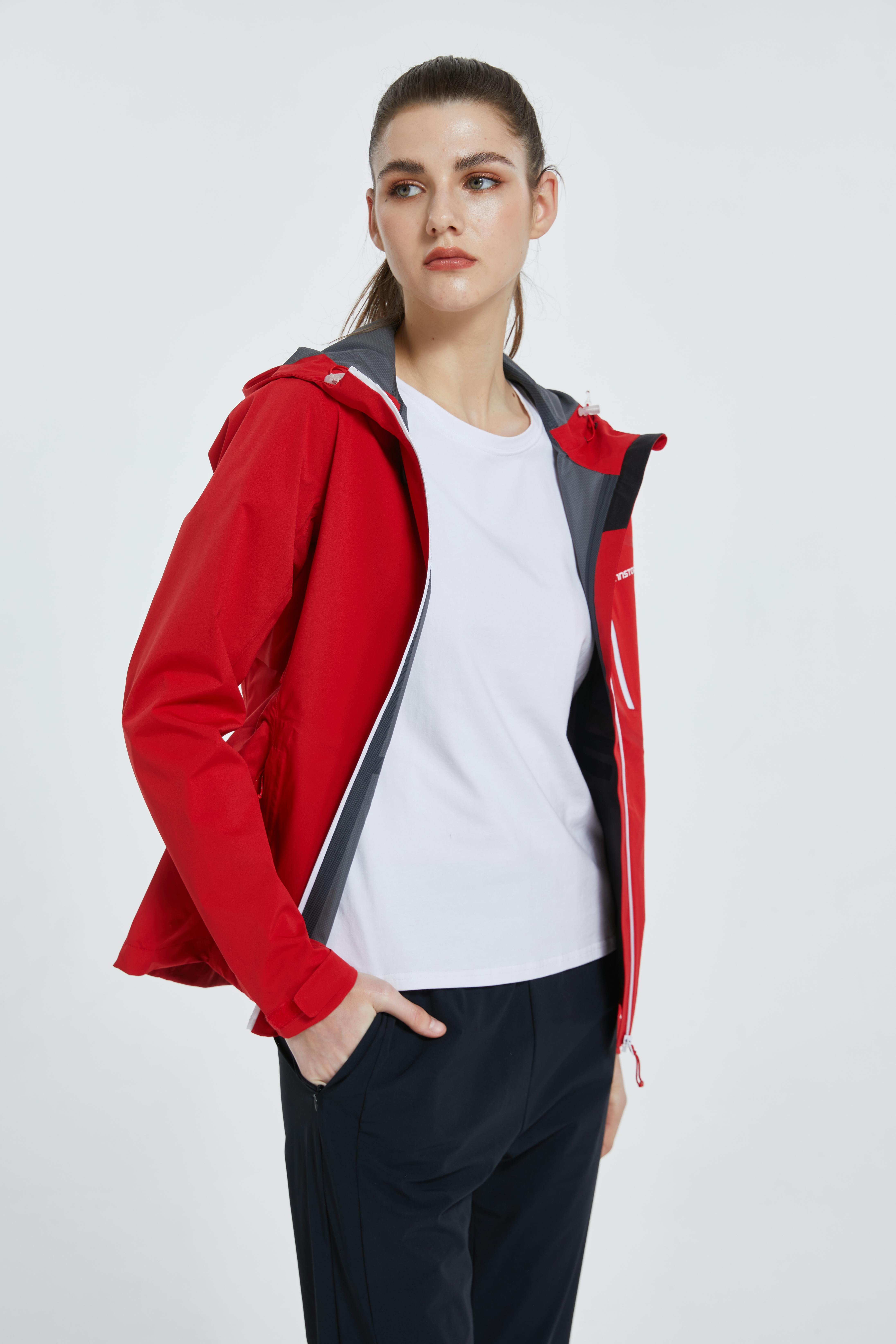 A Young Woman Posing in a Red Jacket · Free Stock Photo