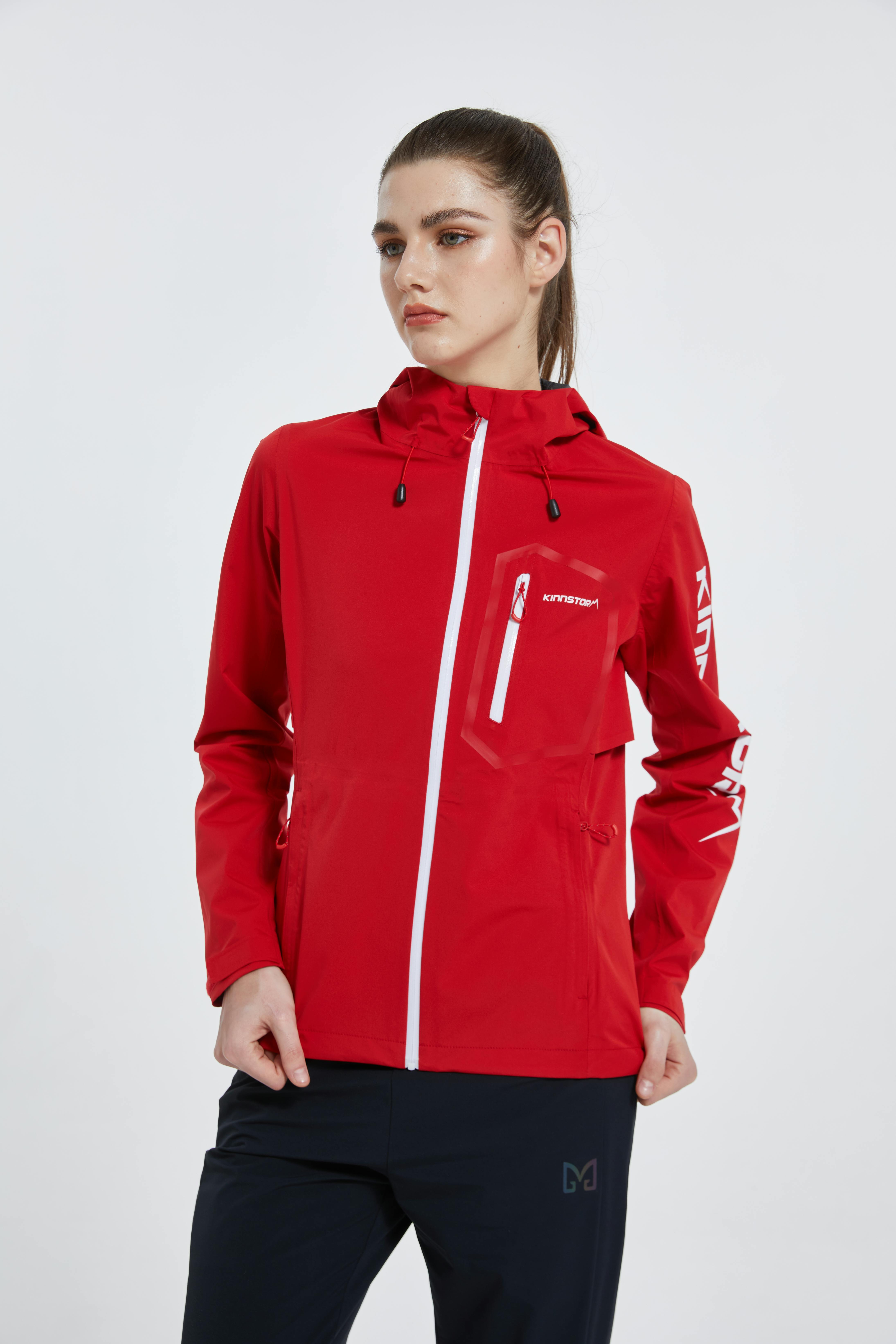 A Young Woman Posing in a Red Jacket · Free Stock Photo