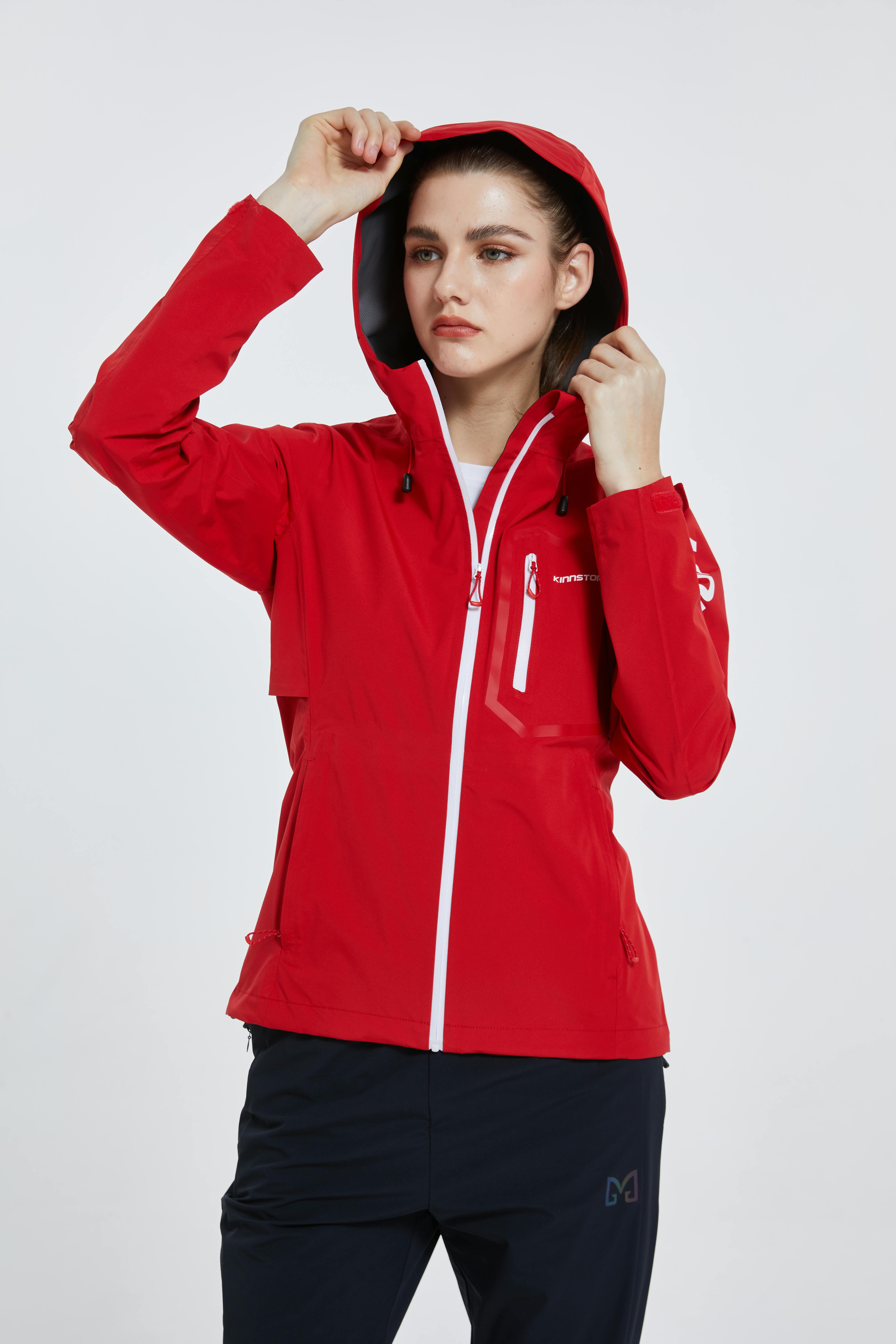 A Young Woman Posing in a Red Jacket · Free Stock Photo