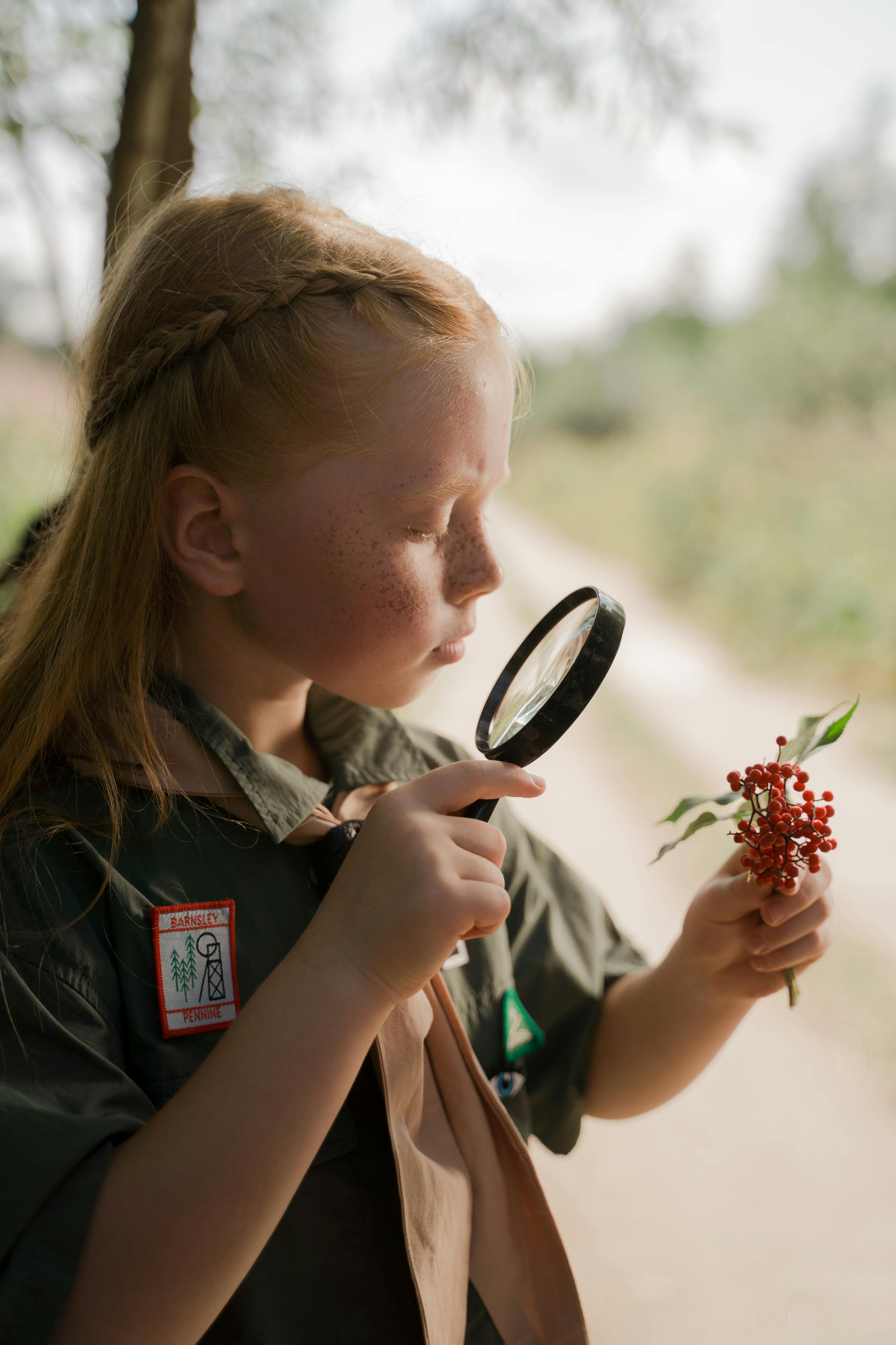 A Girl Using Magnifying Glass · Free Stock Photo