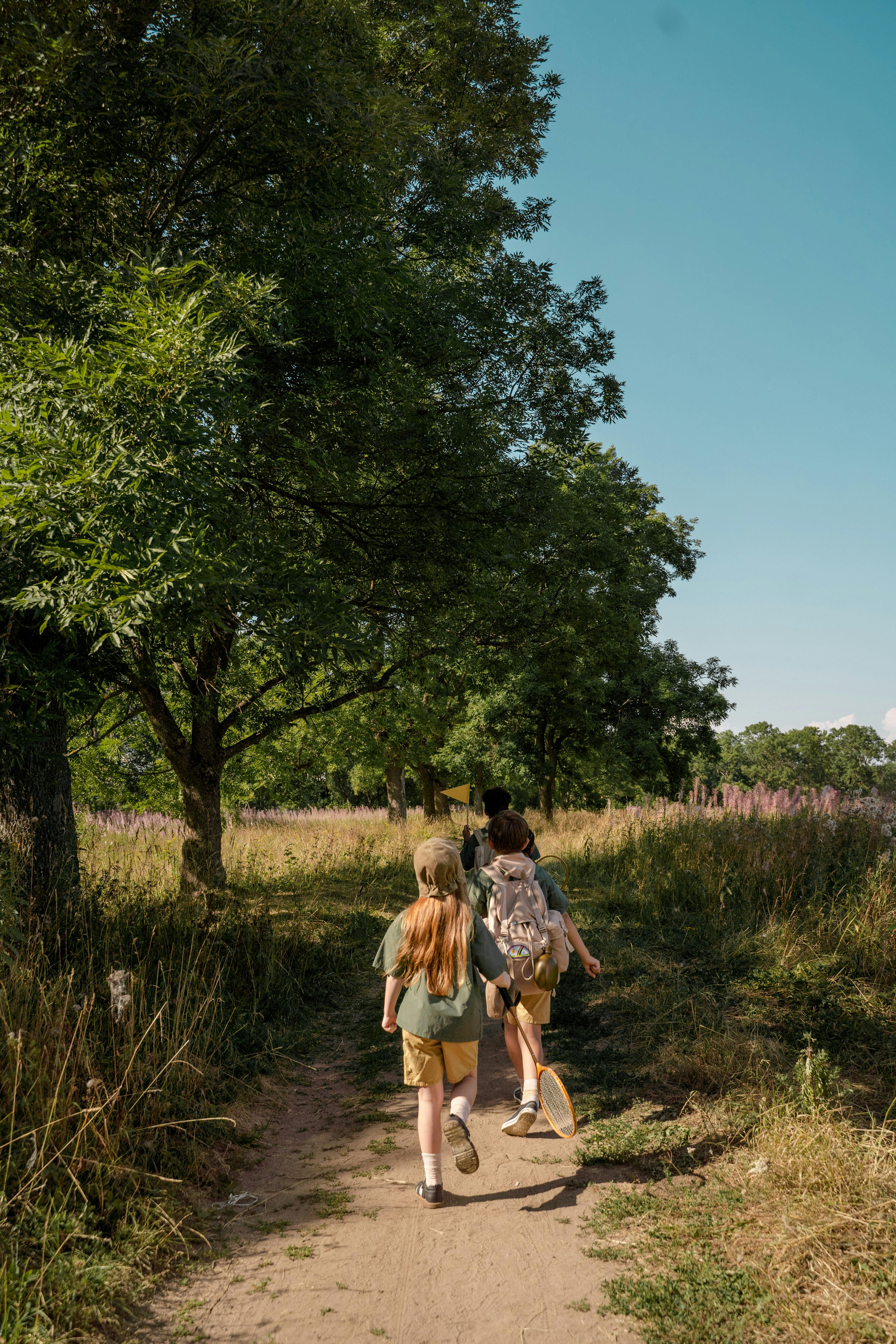 Group of Children Walking on a Pathway · Free Stock Photo