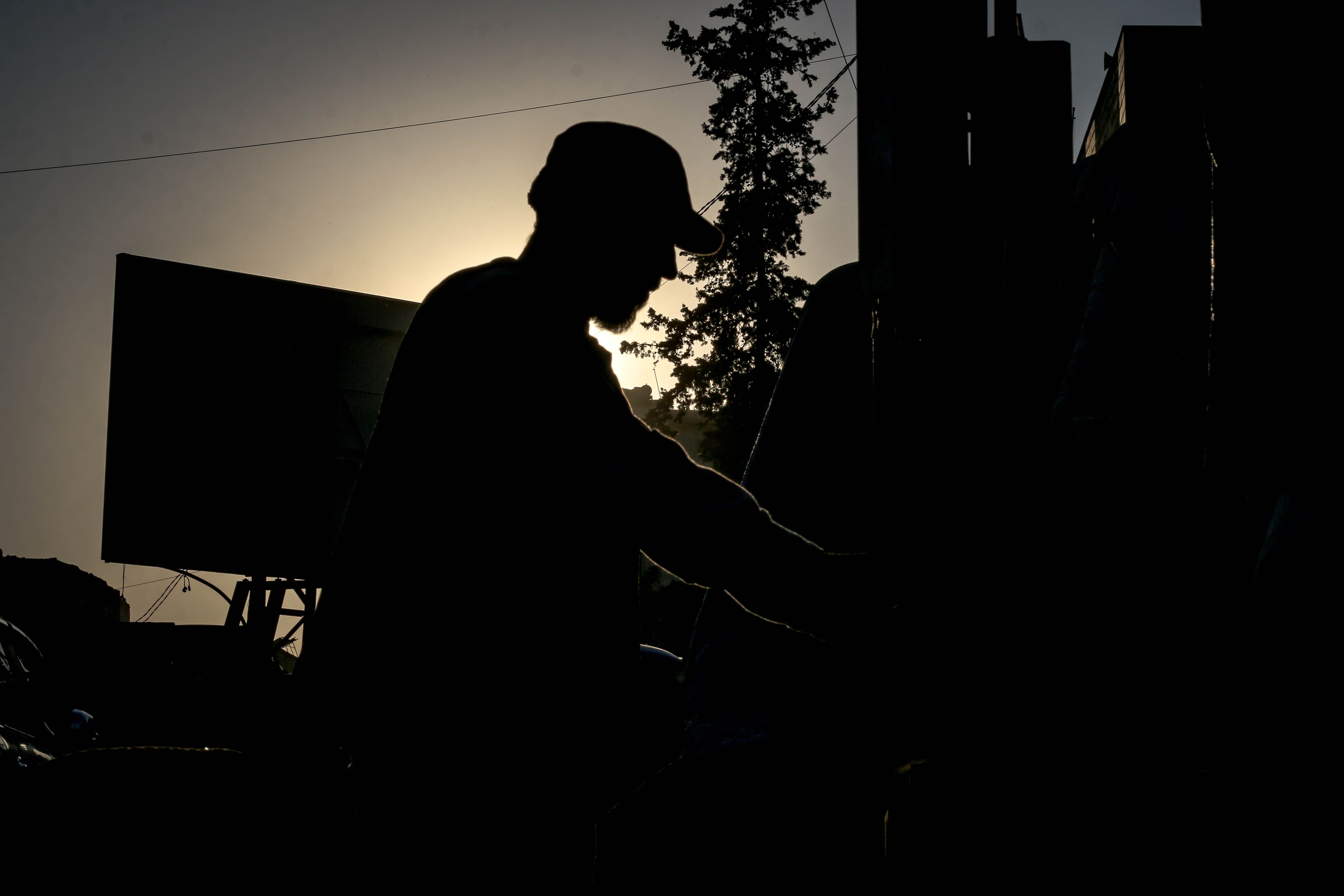 Man in Gray Polo Shirt during Night Time · Free Stock Photo
