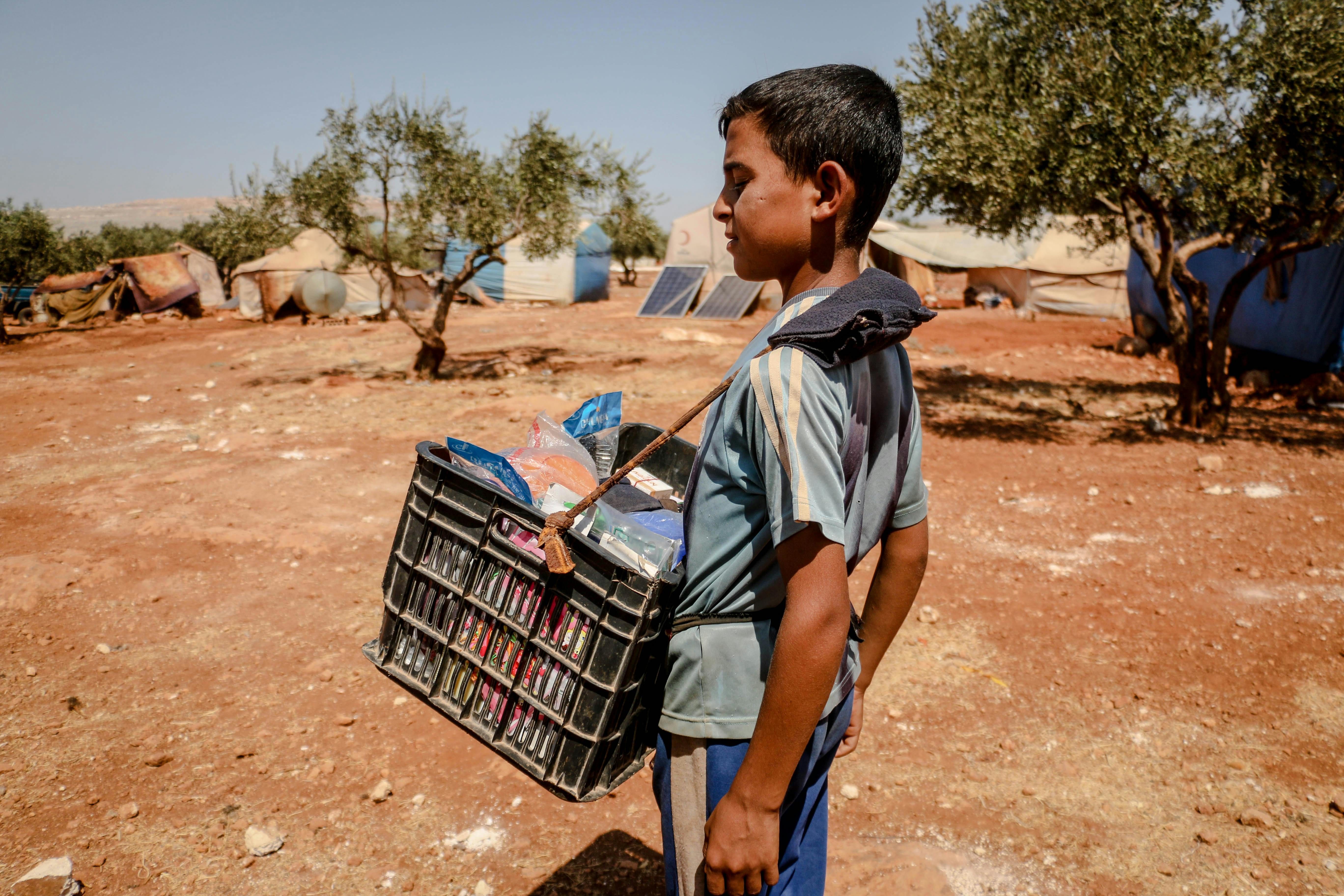Boys Carrying Plastic Crates · Free Stock Photo