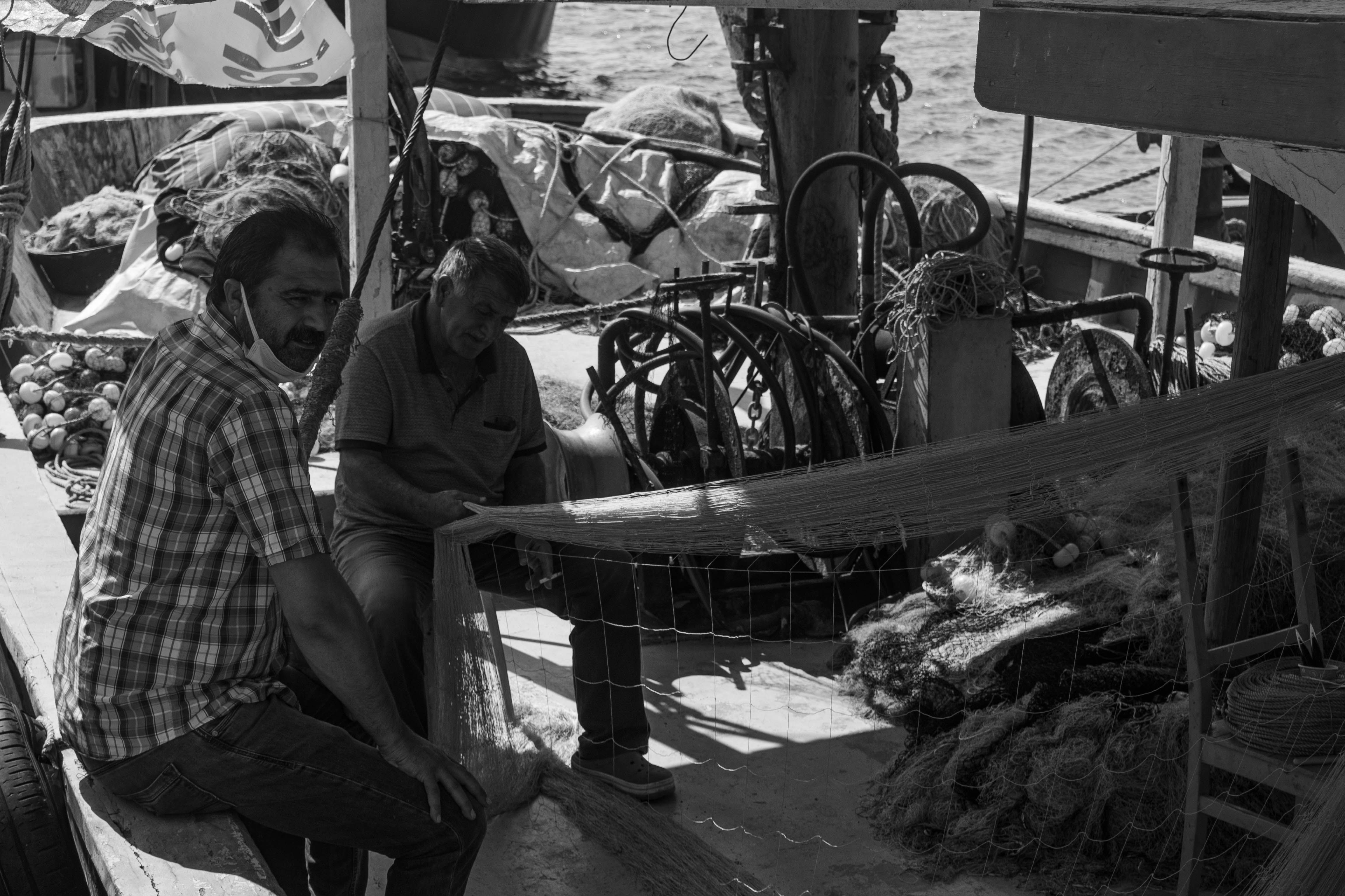 Men Holding A Fishing Net · Free Stock Photo