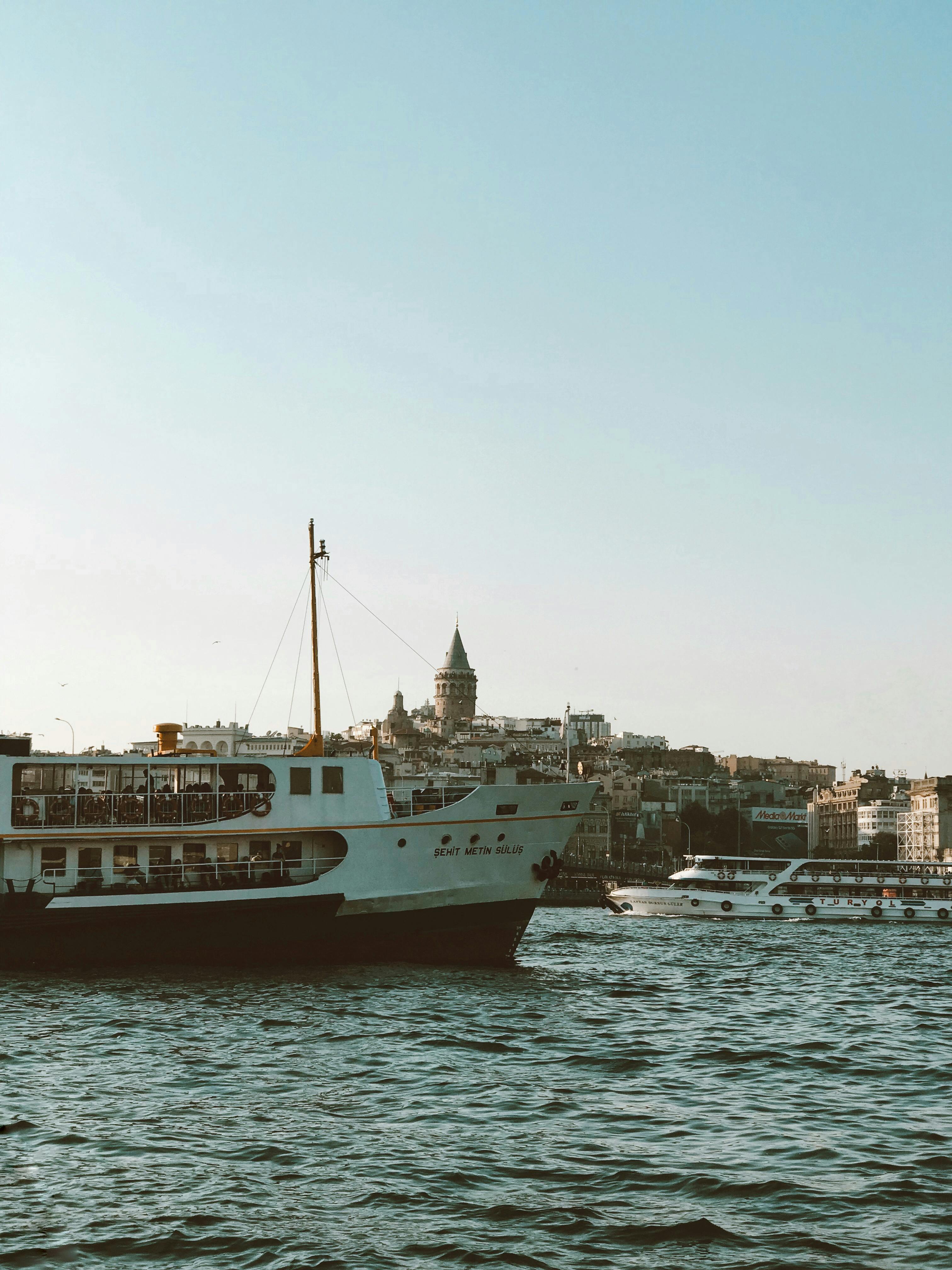 White and Red Ferry Boat on Sea · Free Stock Photo