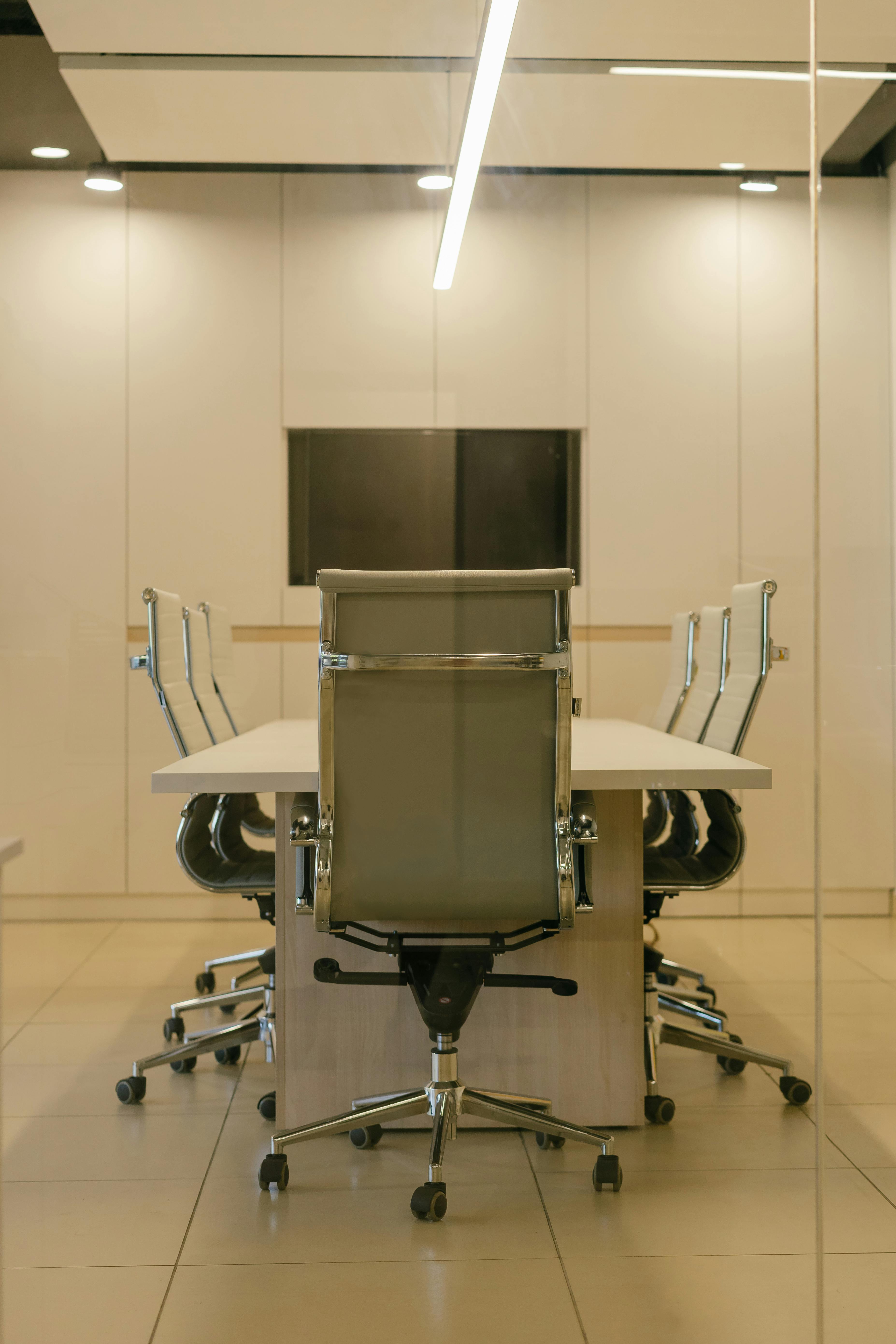 A Table and Chairs in a Conference Room · Free Stock Photo