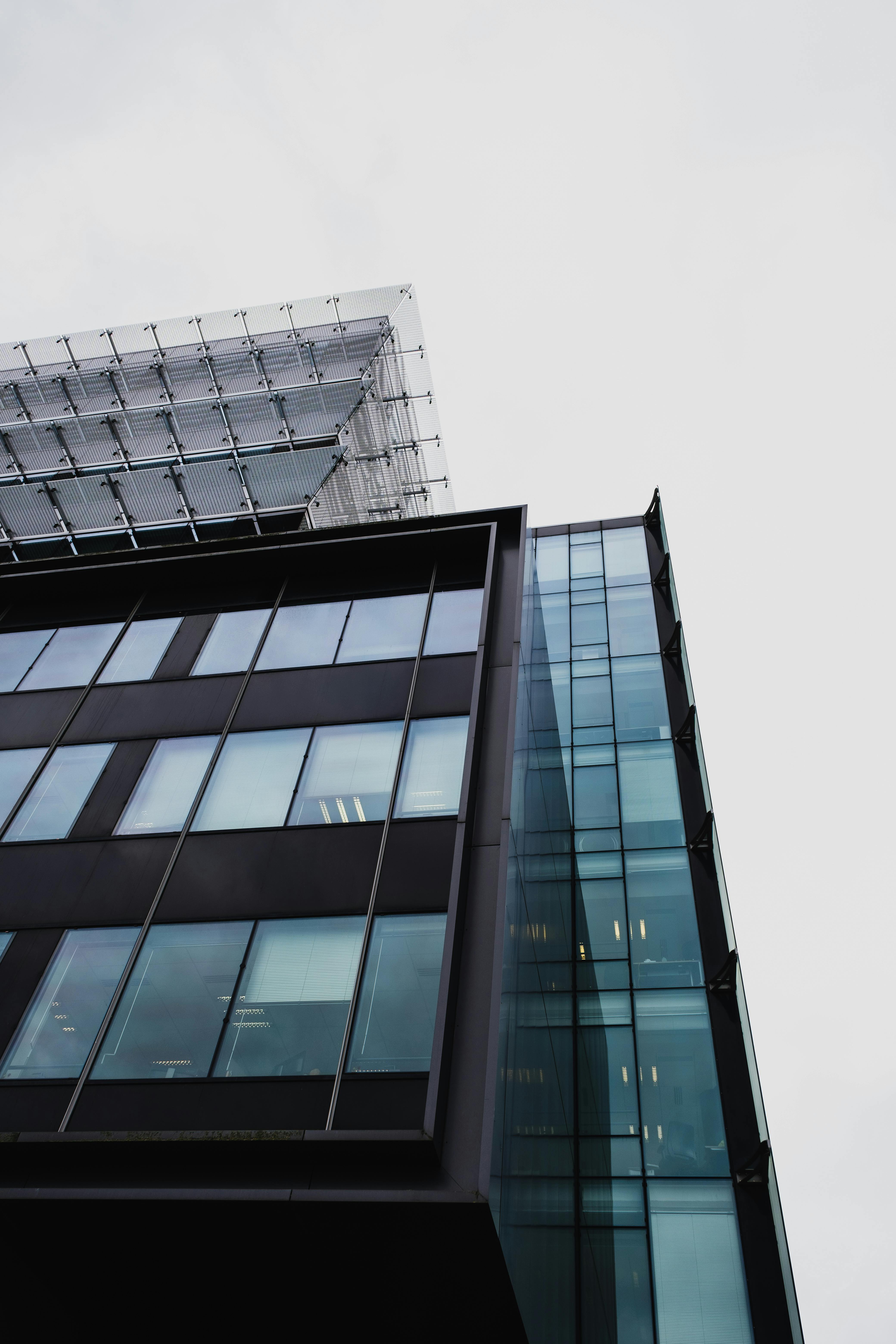 Low-Angle Shot of Glass Windows of a Building · Free Stock Photo