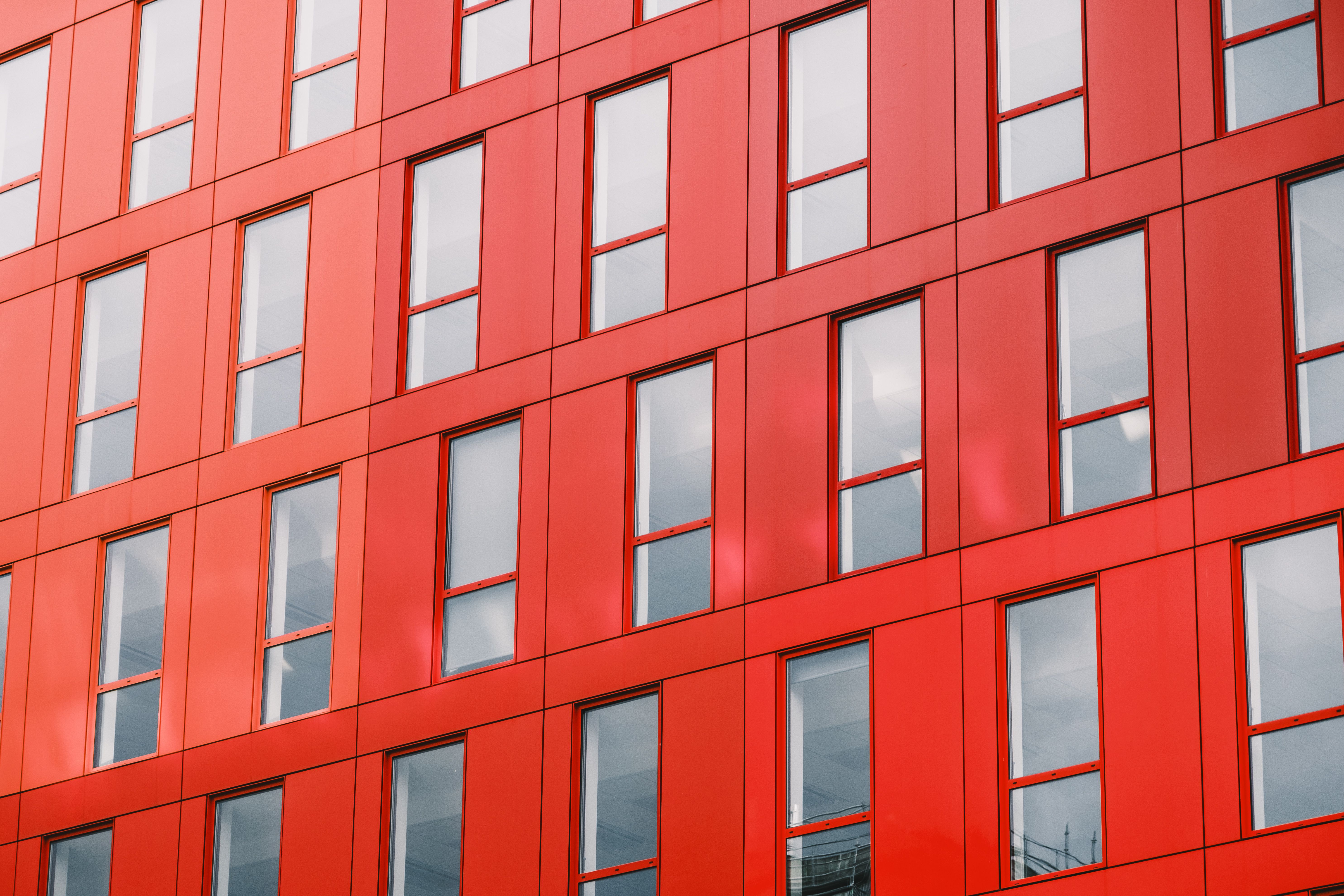 Glass Windows of a Tall Building · Free Stock Photo
