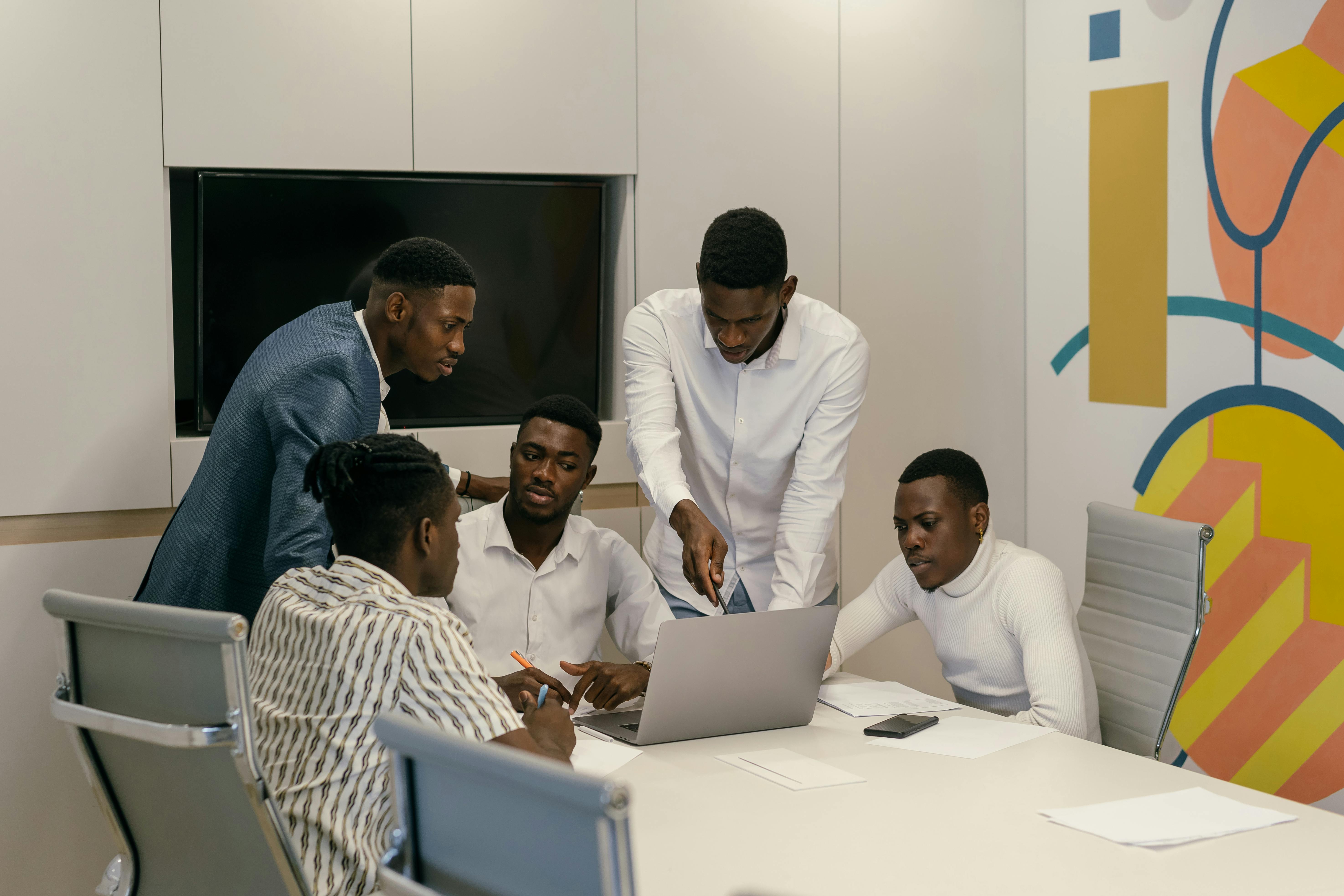 A Group of Men Having a Discussion · Free Stock Photo