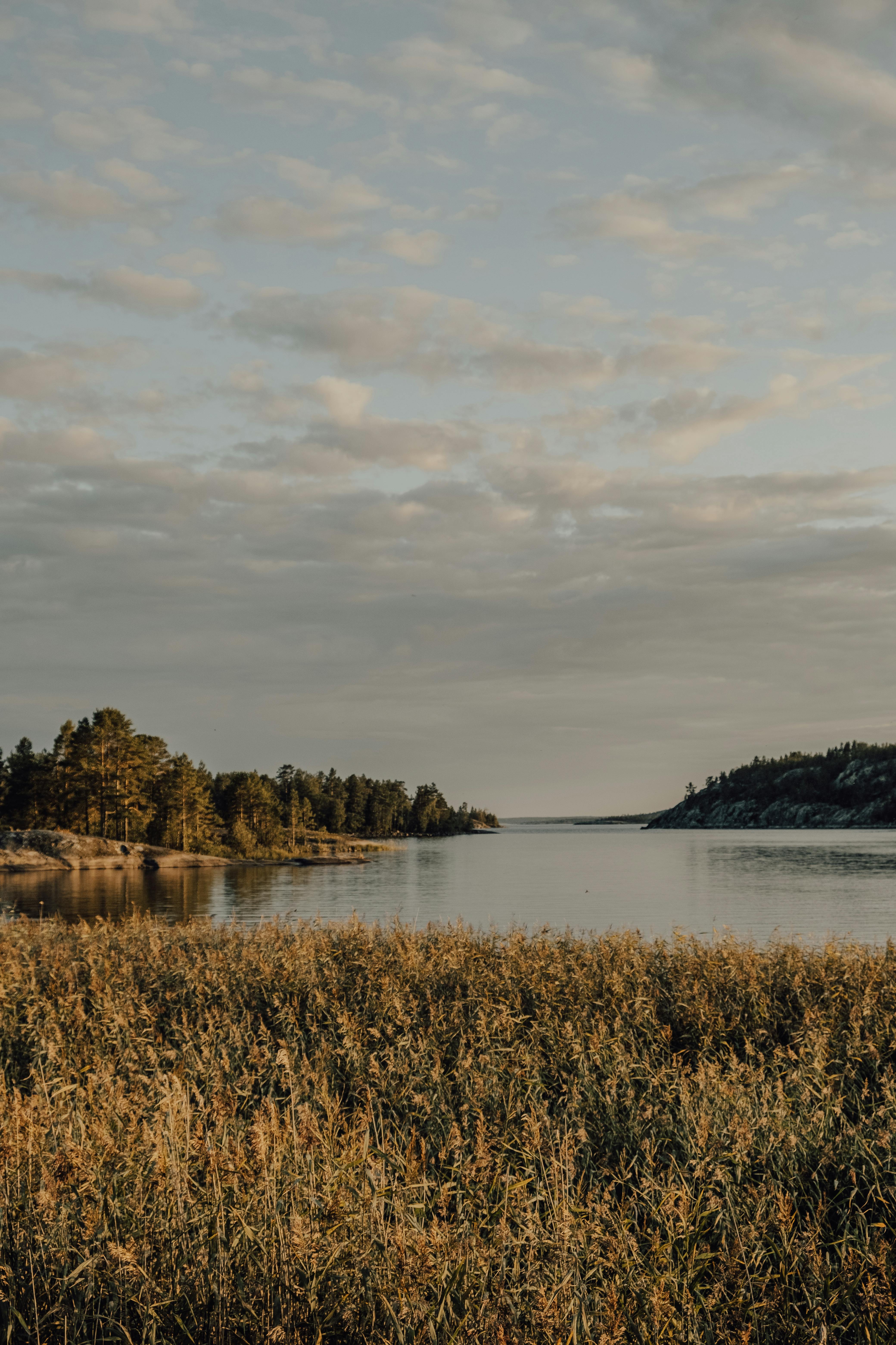 Sun Setting in Calm Still Water · Free Stock Photo