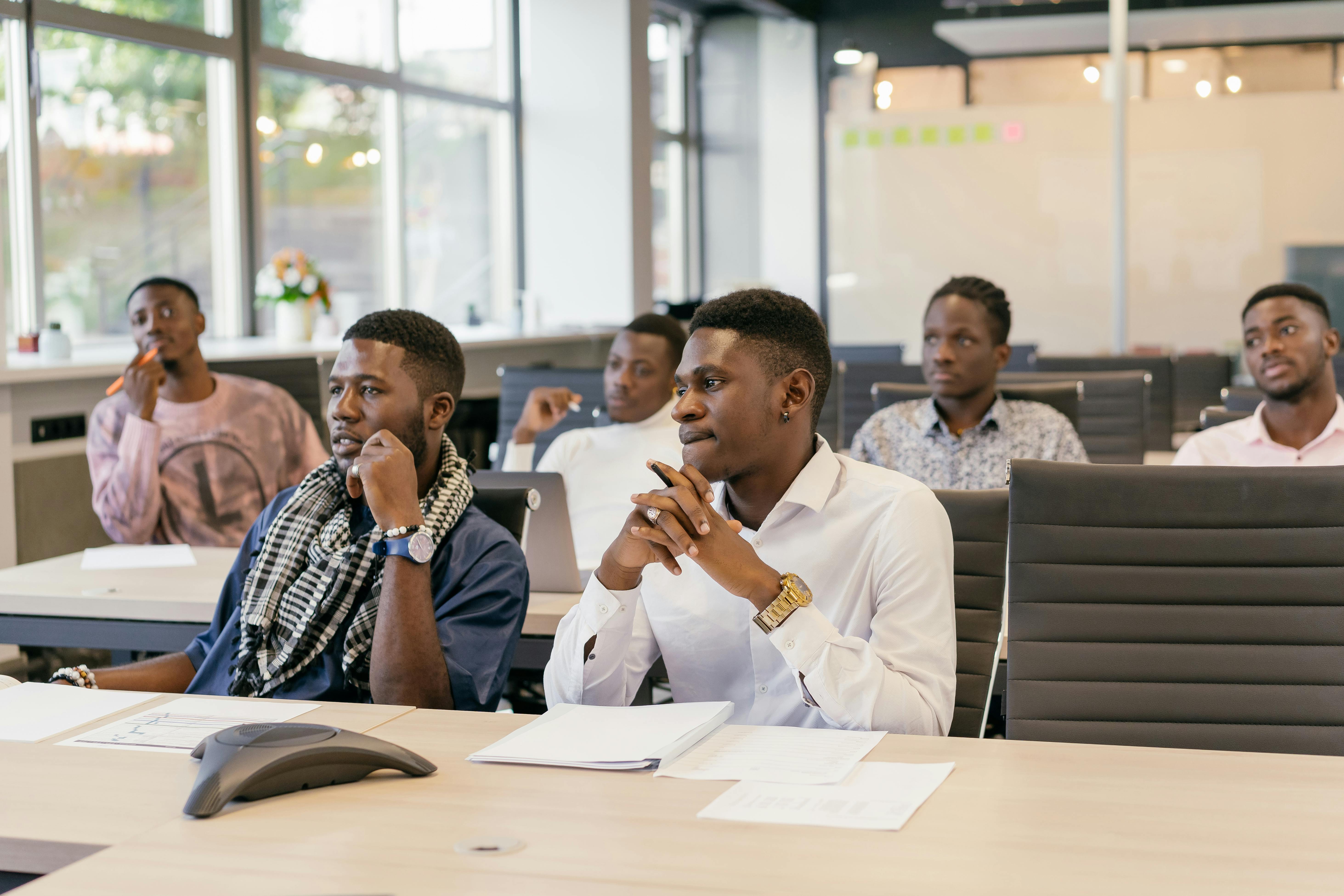 Men Sitting in a Conference Room · Free Stock Photo