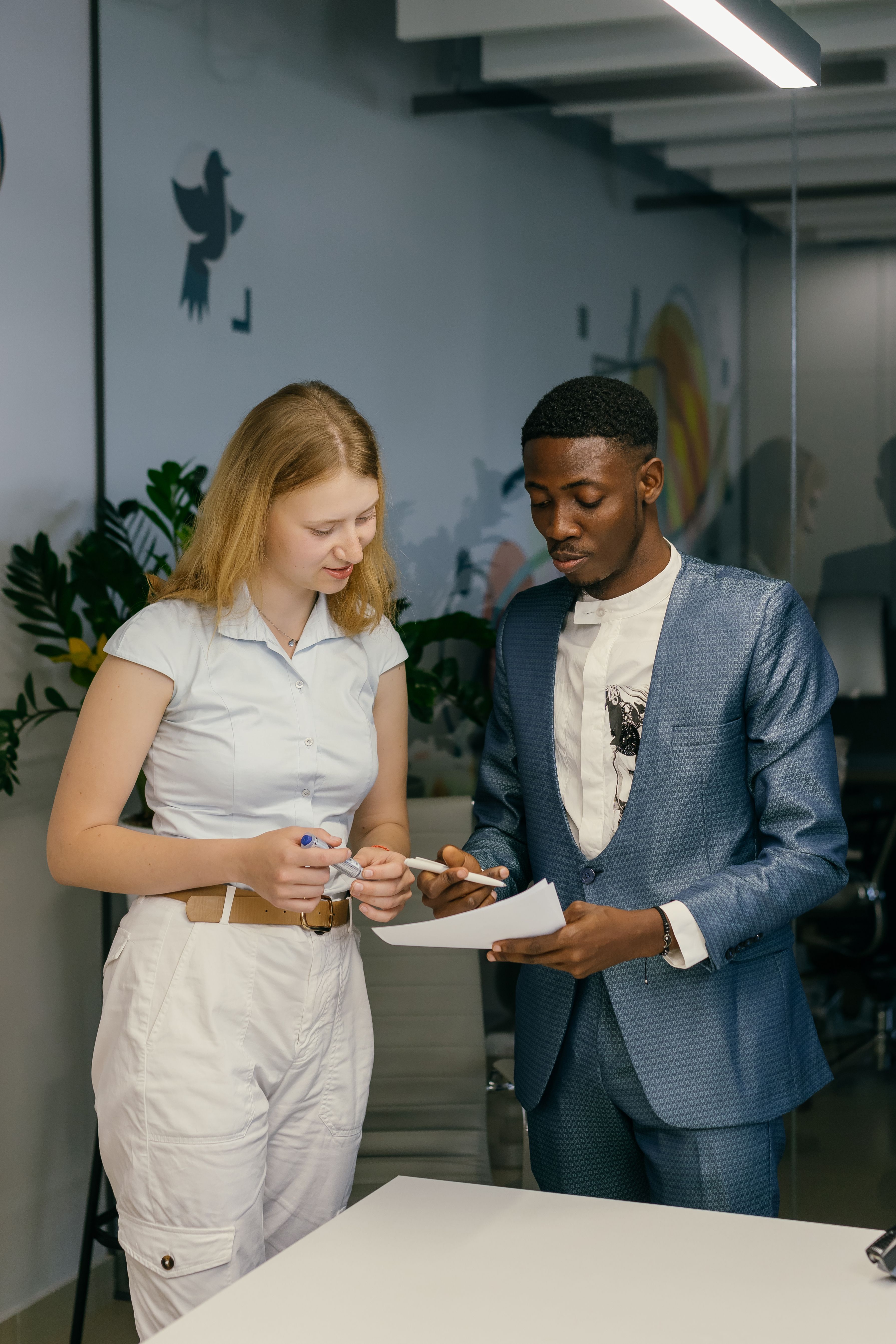 Two Women Holding Documents · Free Stock Photo