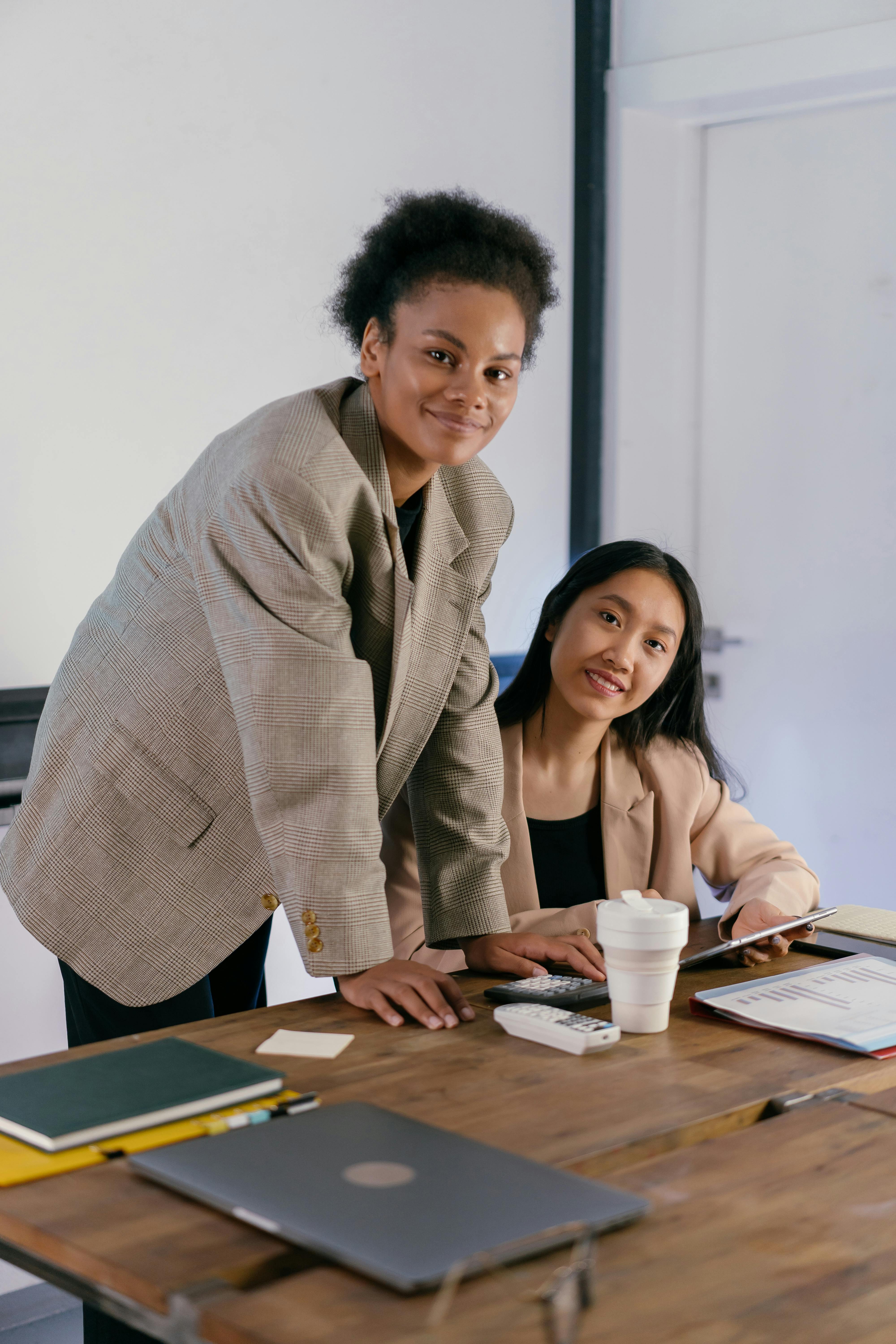 Photograph of Colleagues Talking while Smiling · Free Stock Photo