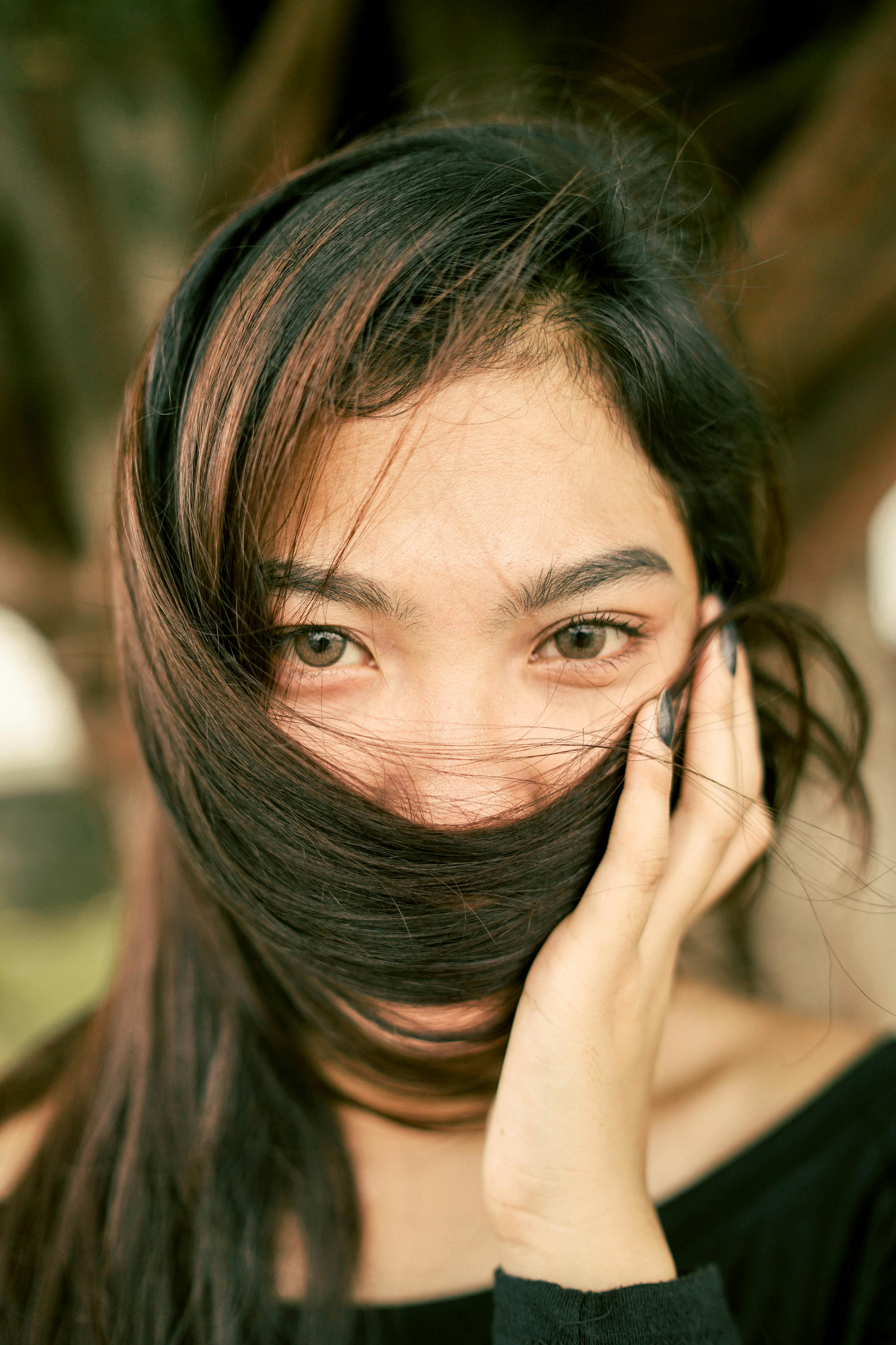 Woman Covering Her Face With Her Hair · Free Stock Photo