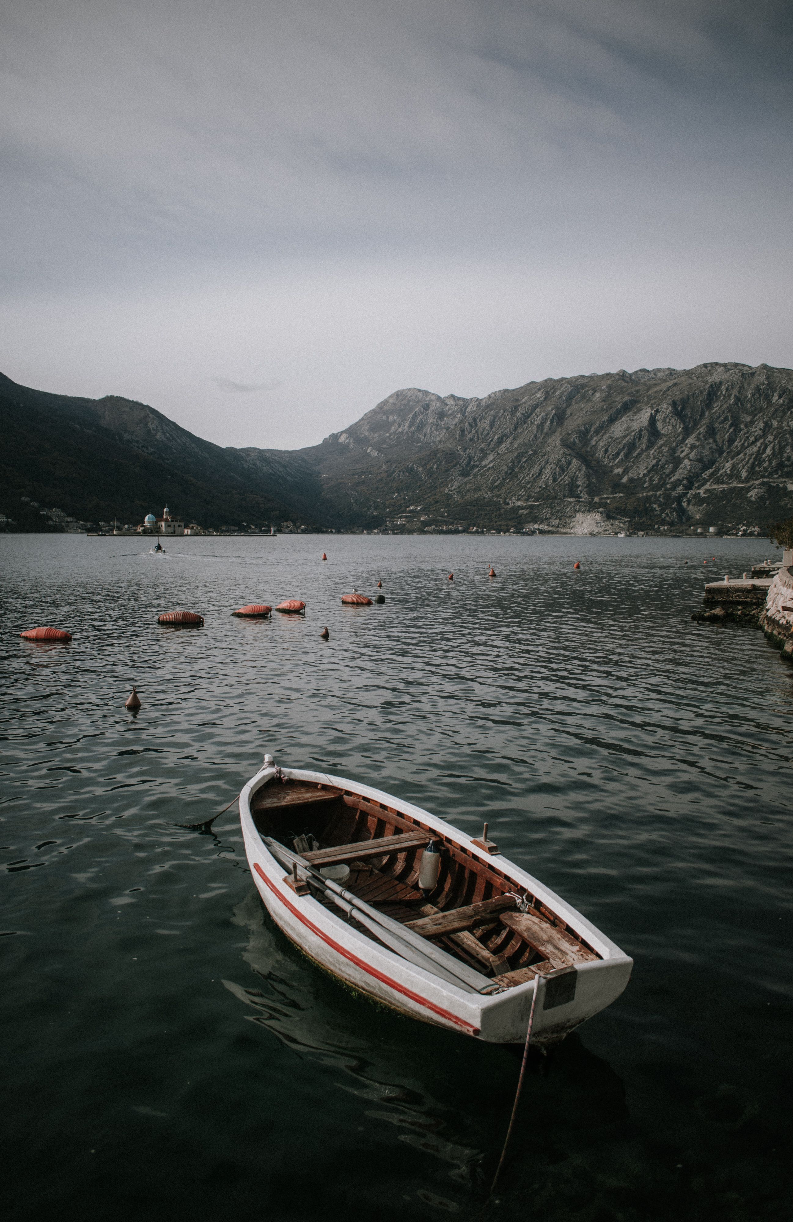 An Empty Rowboat Docked on Lake · Free Stock Photo