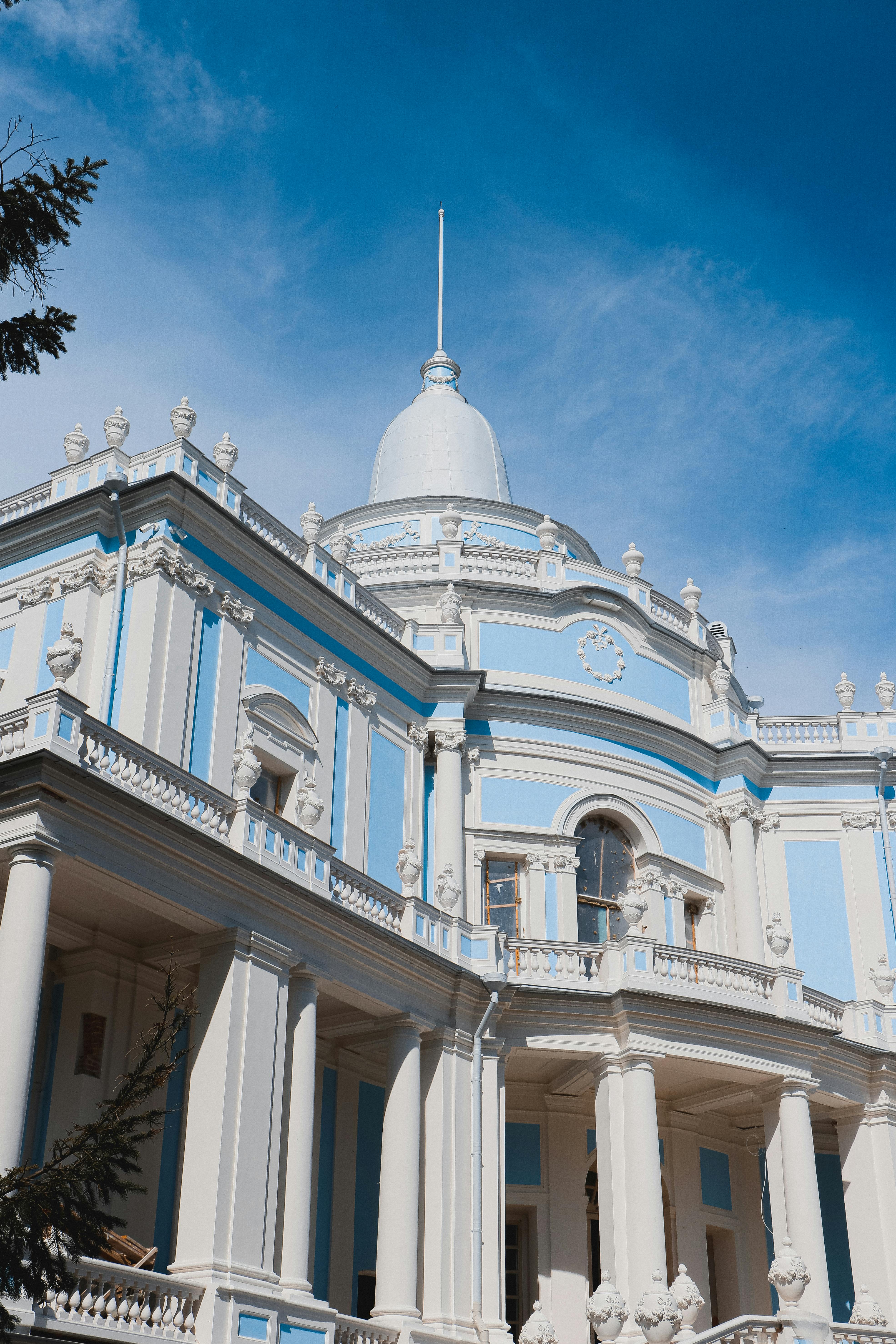 Photo of a White and Blue Building · Free Stock Photo
