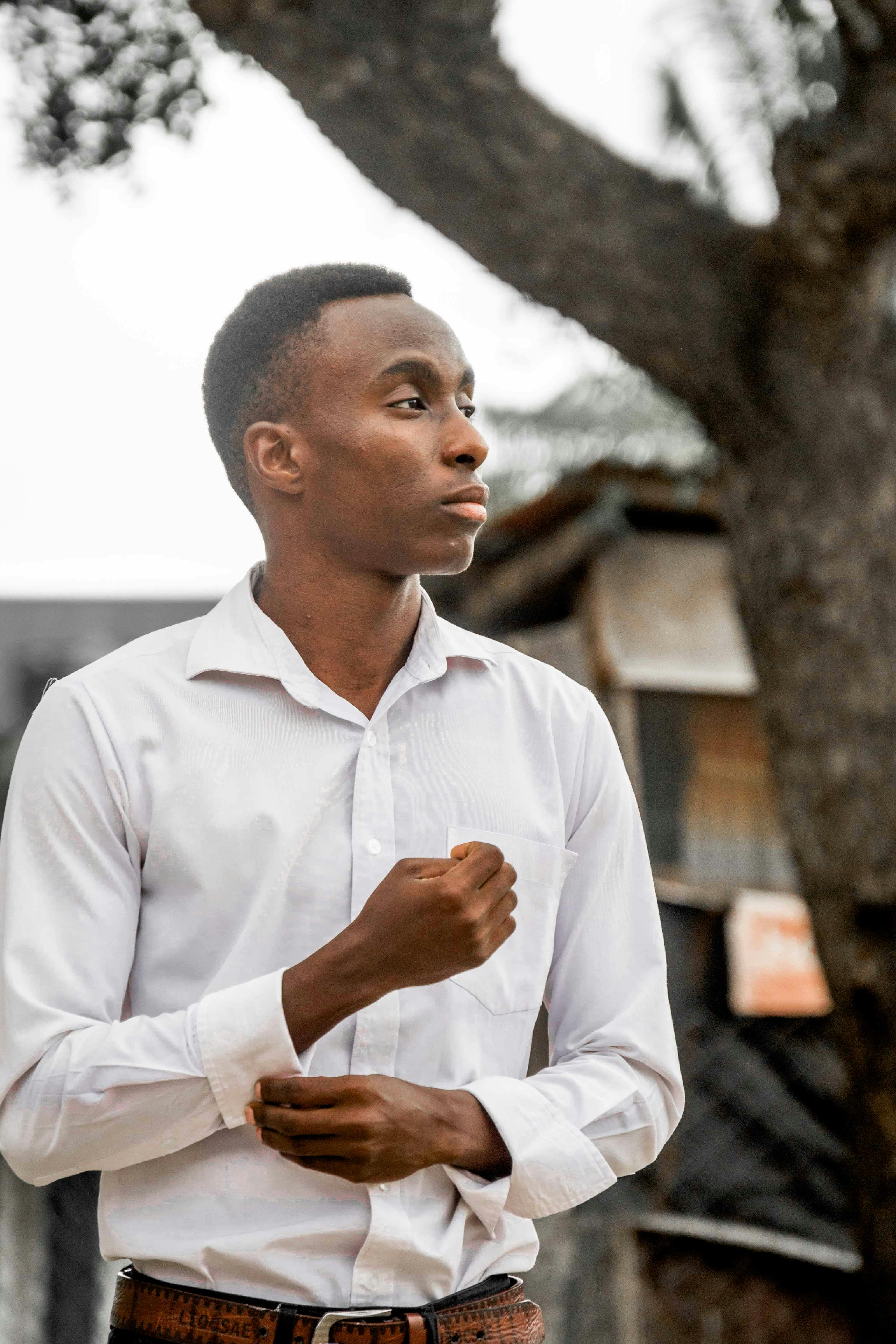 A Brawny Man Posing for a Photoshoot · Free Stock Photo