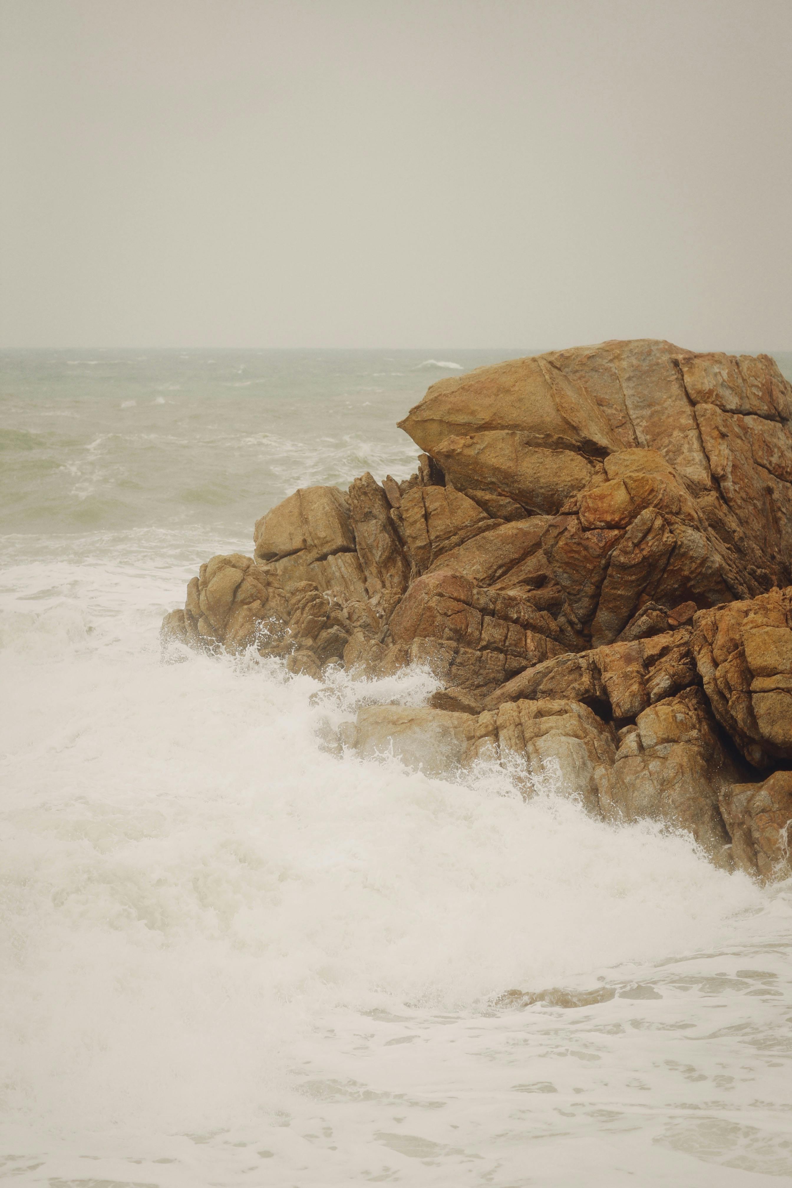 Black Rocks on Seashore · Free Stock Photo
