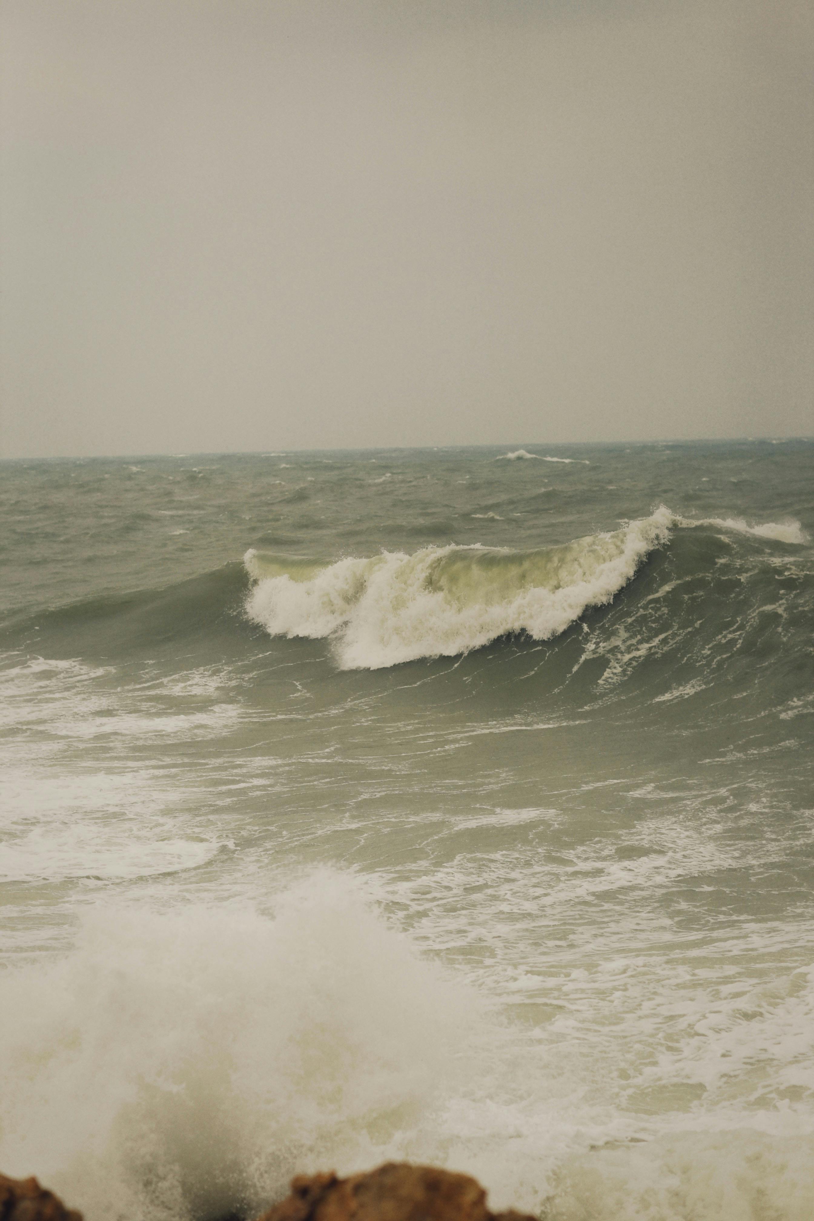 Waves Splashing on Rocks · Free Stock Photo