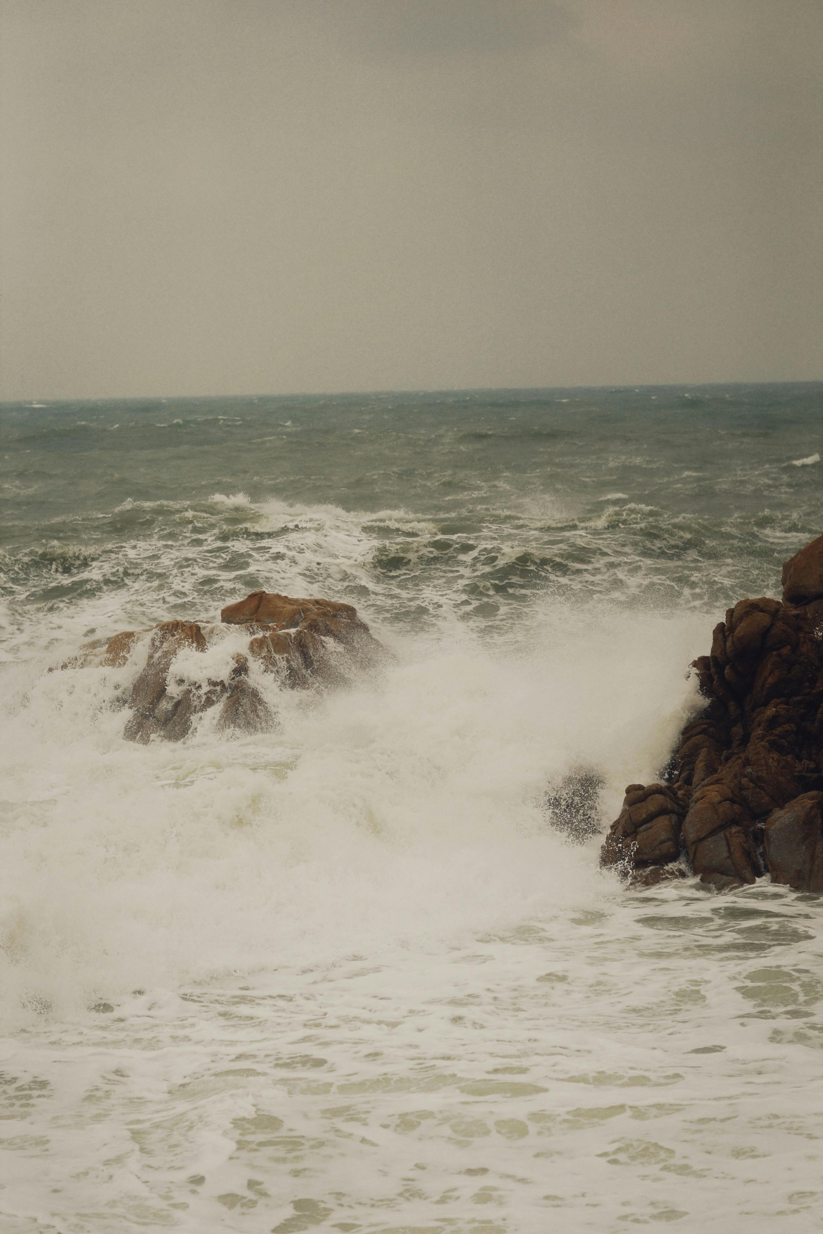 Waves Splashing on Rocks · Free Stock Photo